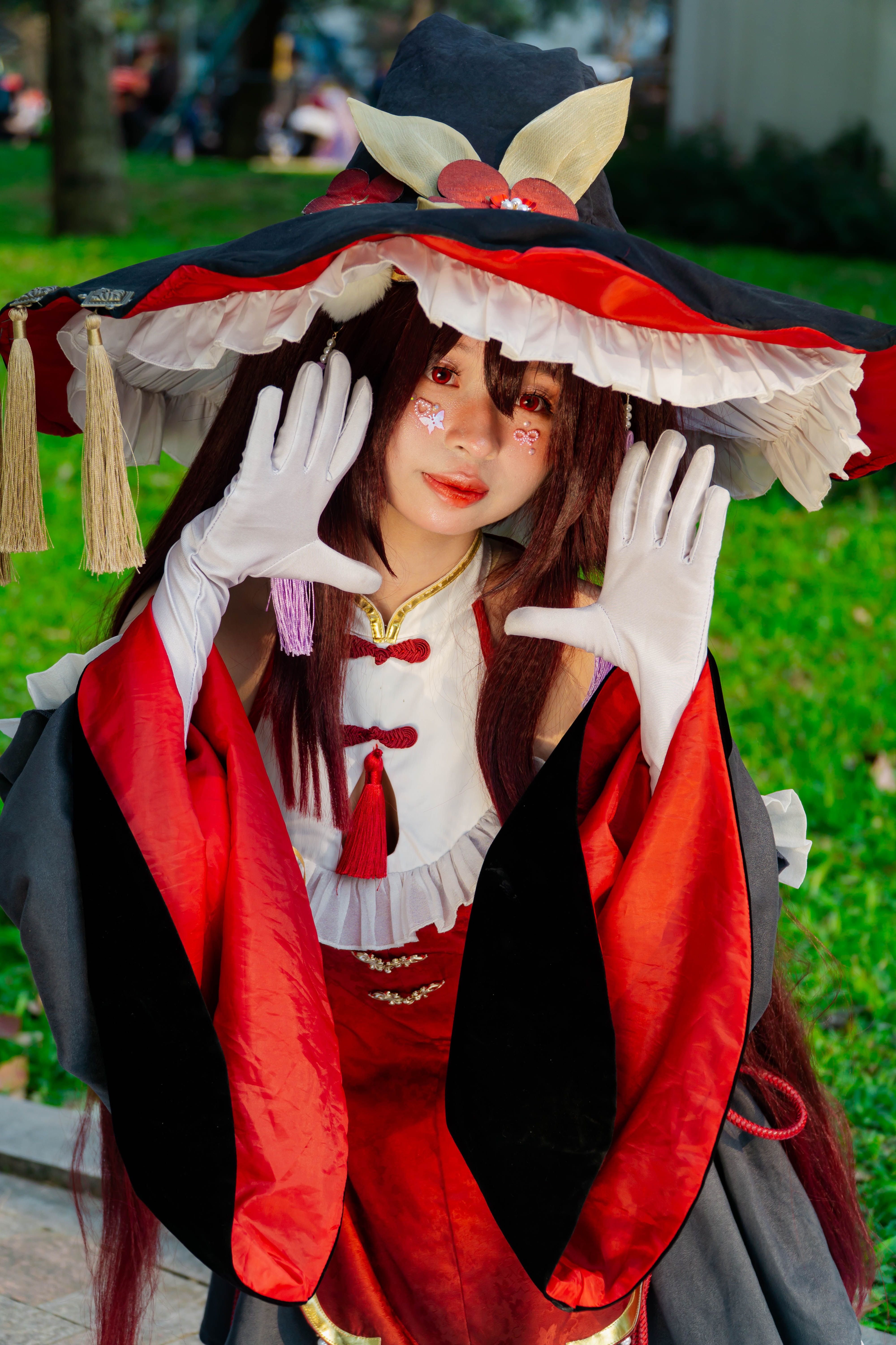 Cosplayer in Vibrant Witch Costume Outdoors · Free Stock Photo