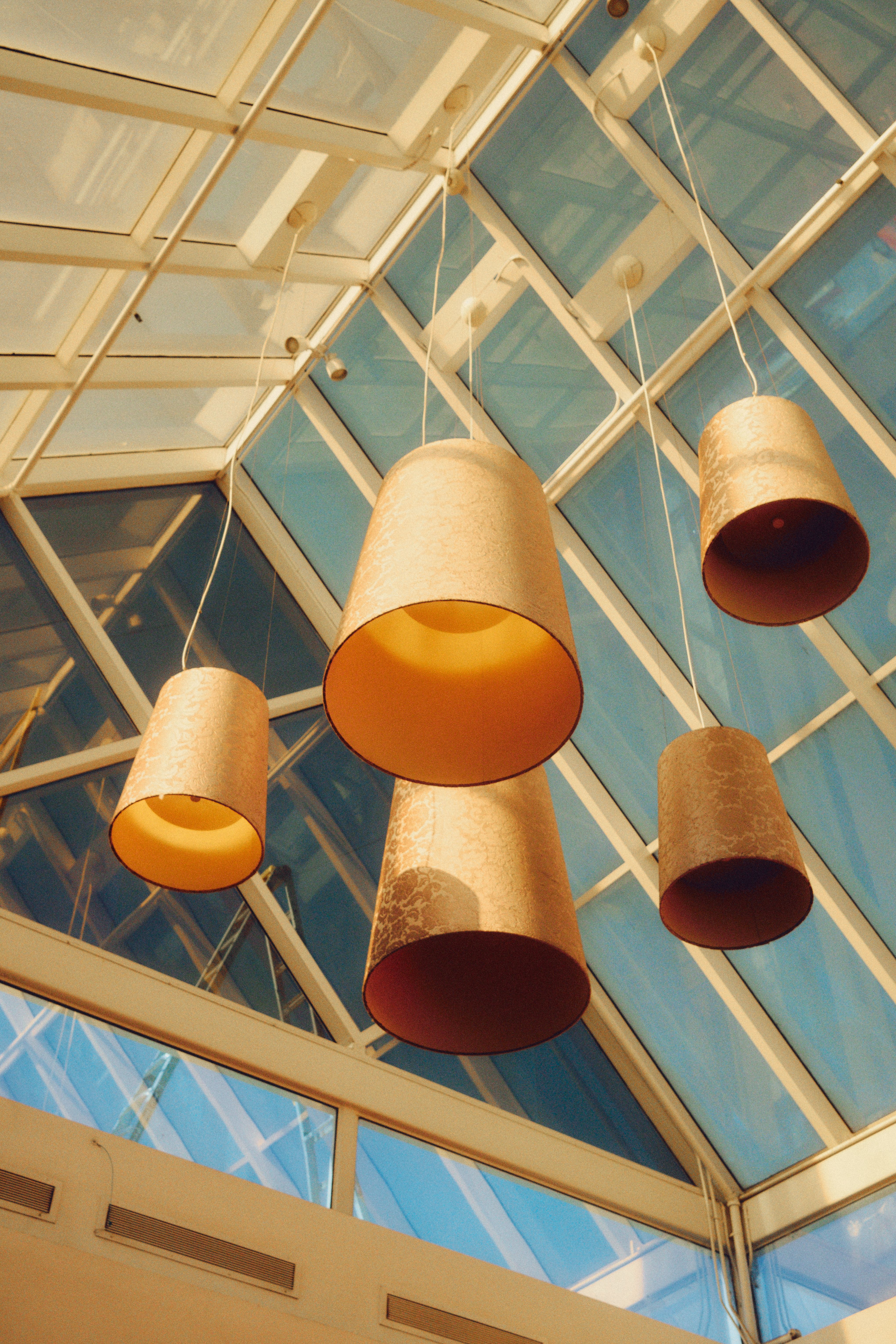 Elegant Hanging Lamps in Skylit Atrium · Free Stock Photo
