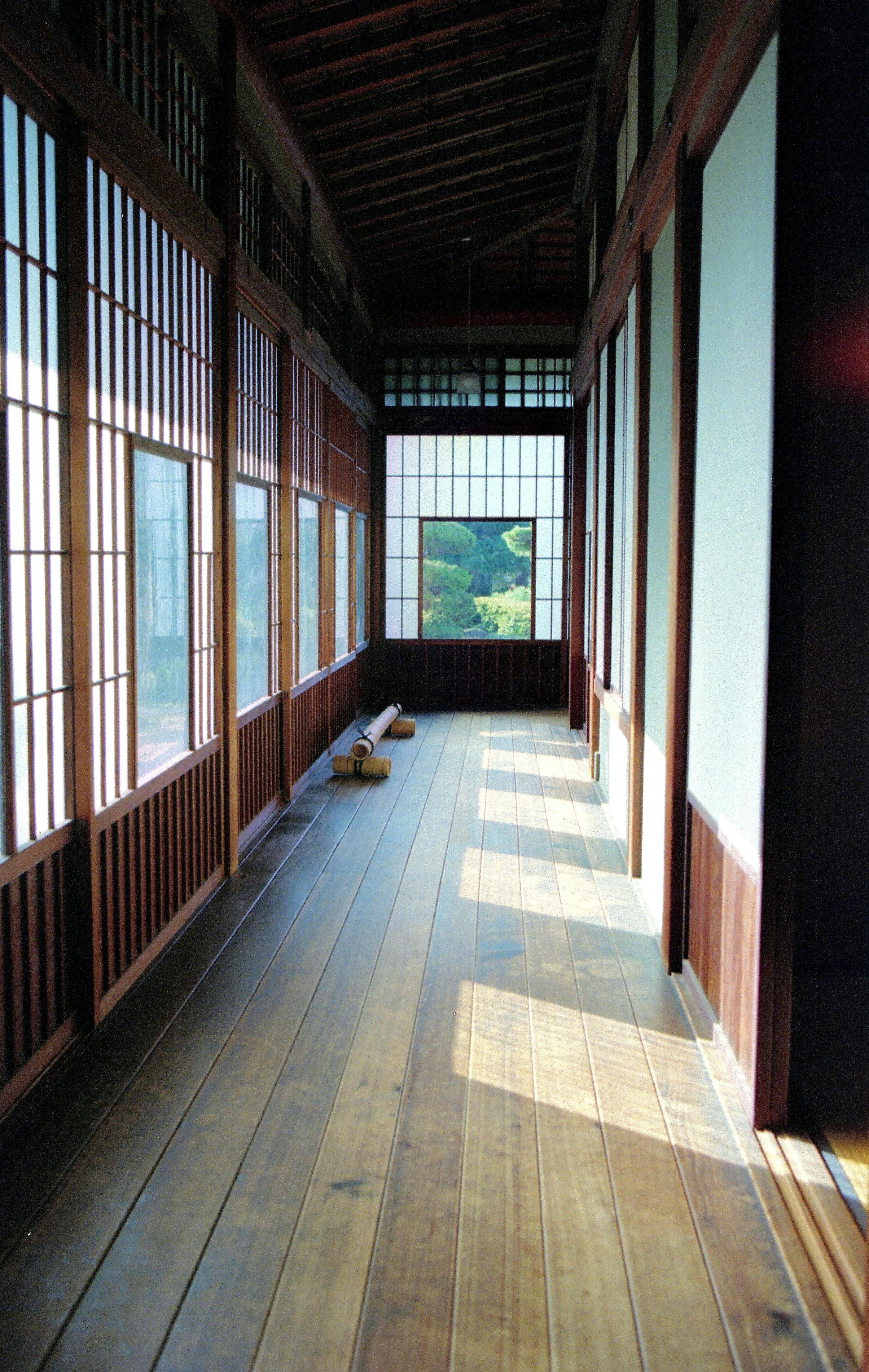 Traditional Japanese Corridor with Sunlit Walkway · Free Stock Photo