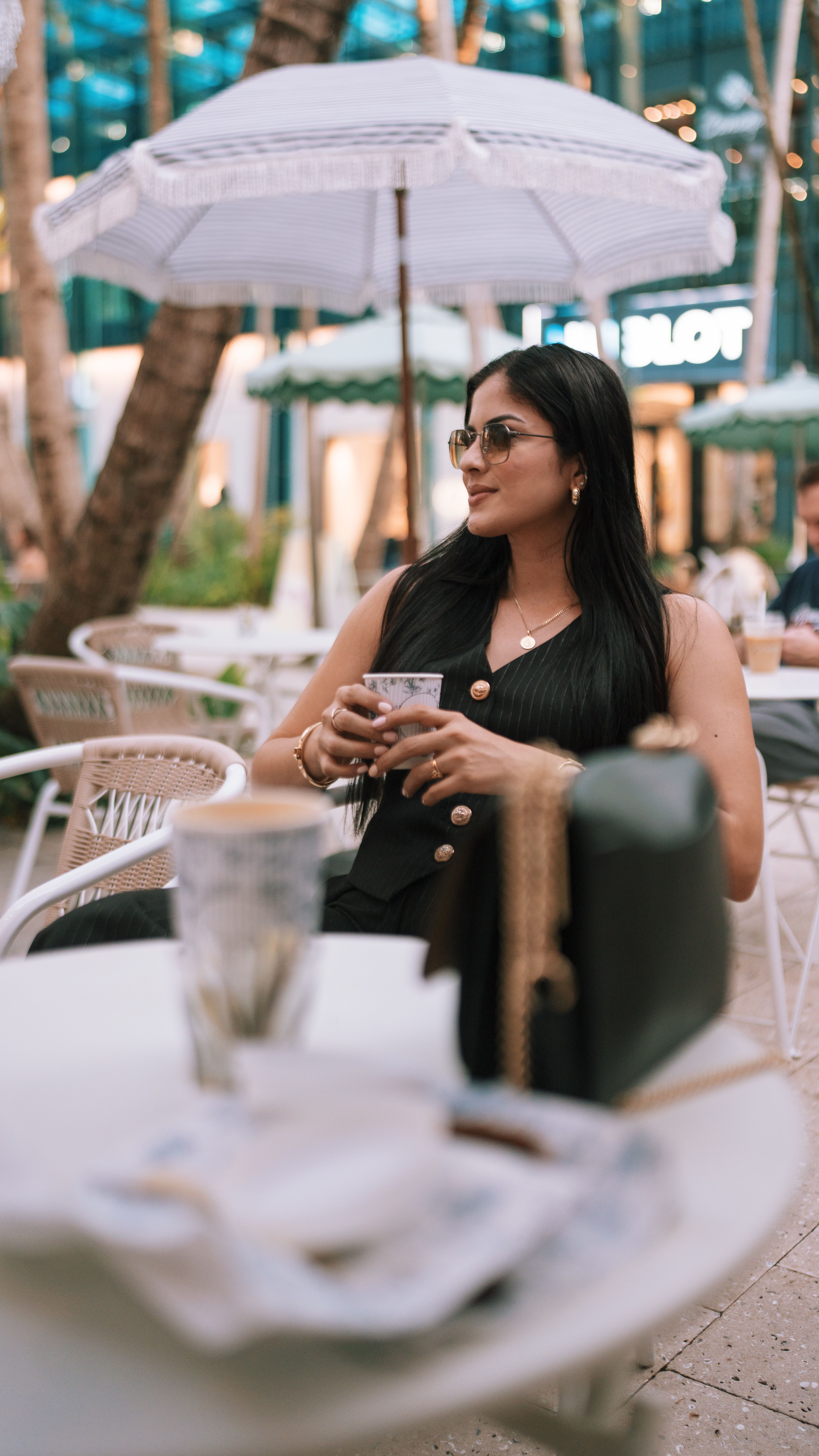 Chic Outdoor Cafe Scene with Relaxed Woman · Free Stock Photo