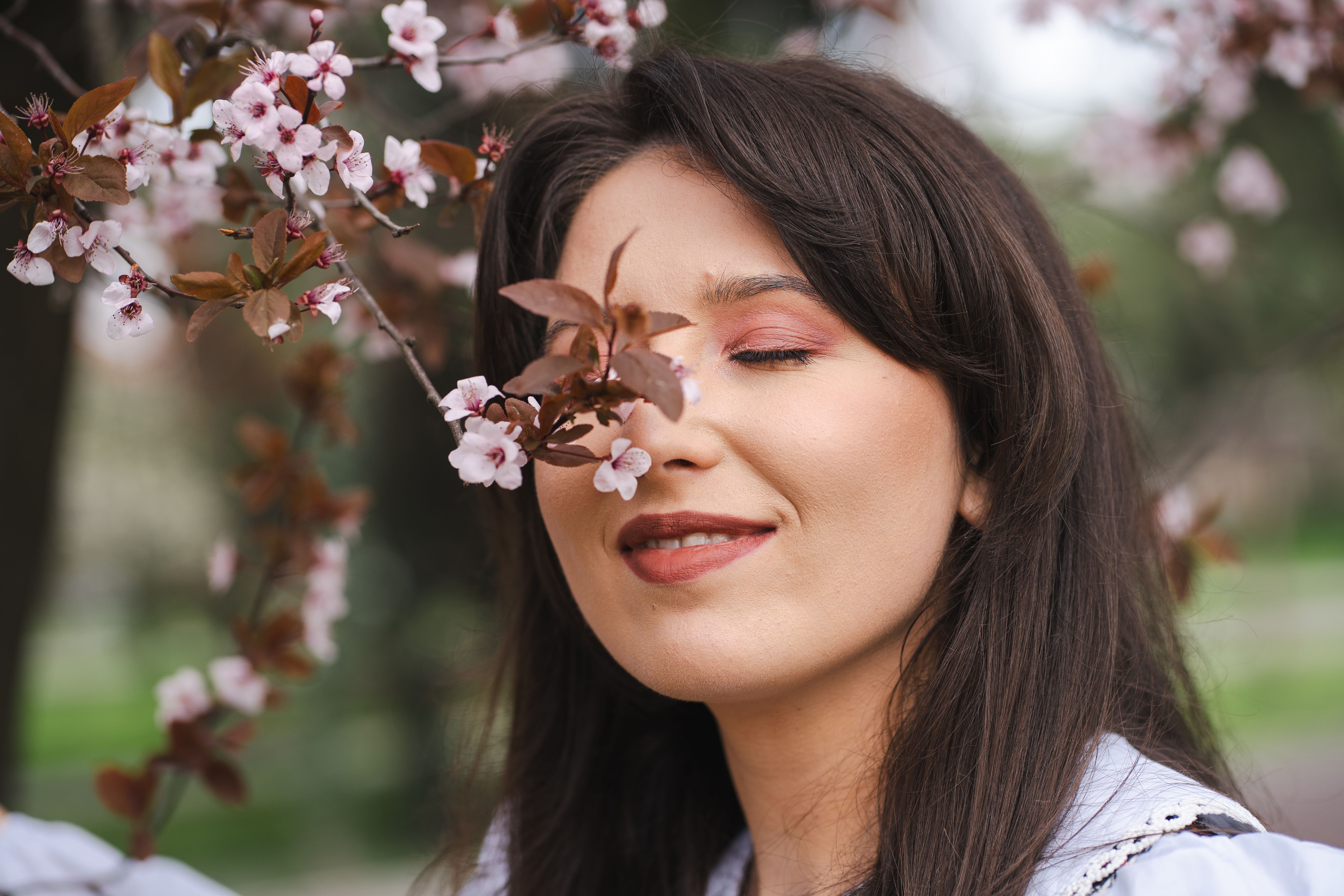 Serene Portrait of Woman Amidst Cherry Blossoms · Free Stock Photo