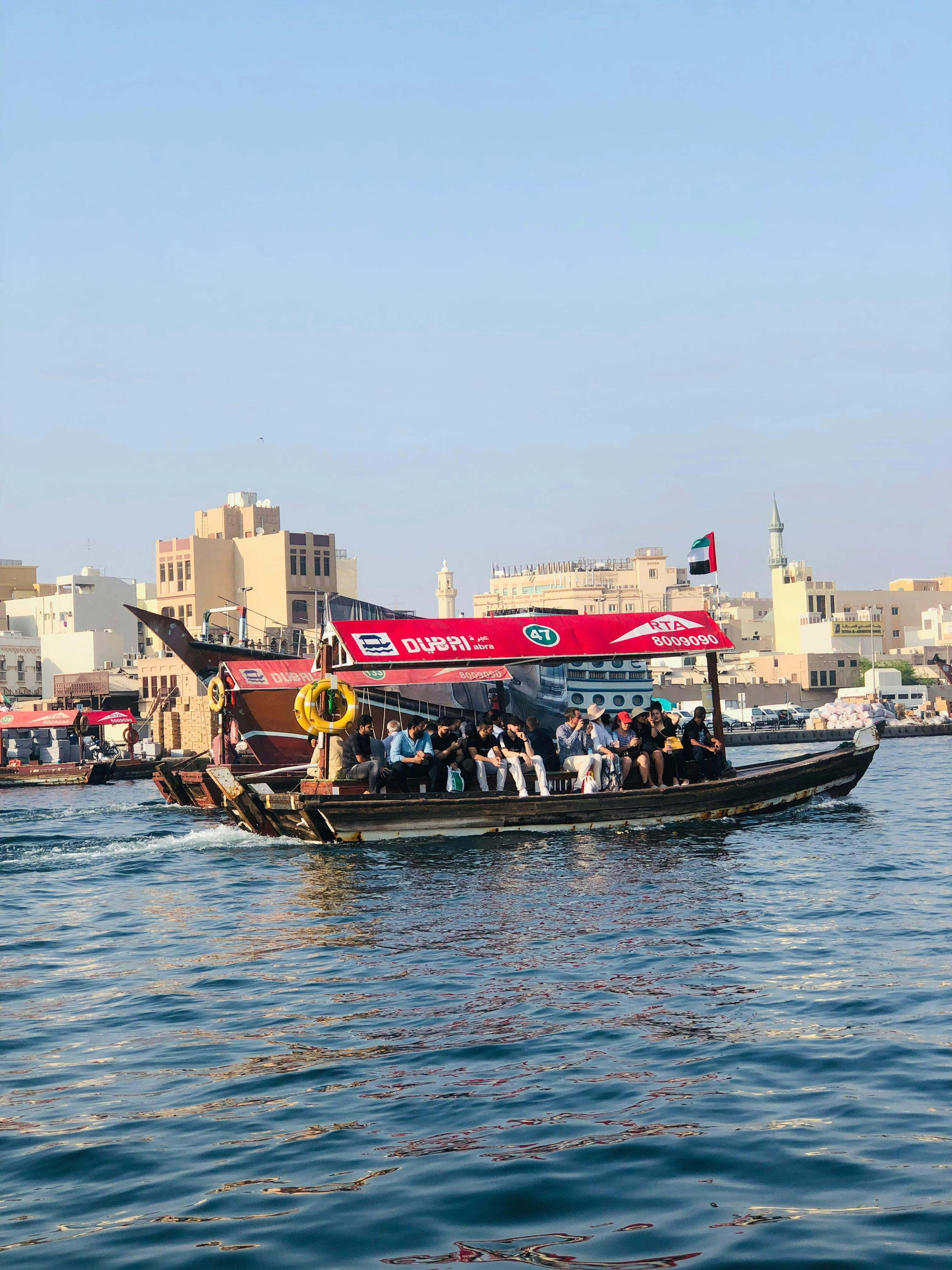 Traditional Abra Sailing in Dubai Creek · Free Stock Photo