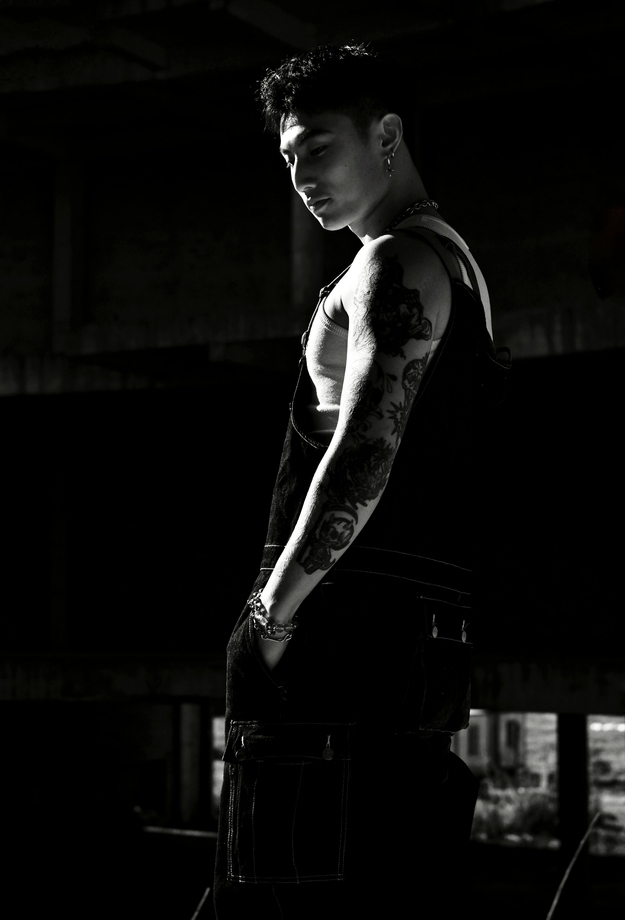Dramatic Black and White Portrait of a Tattooed Man · Free Stock Photo