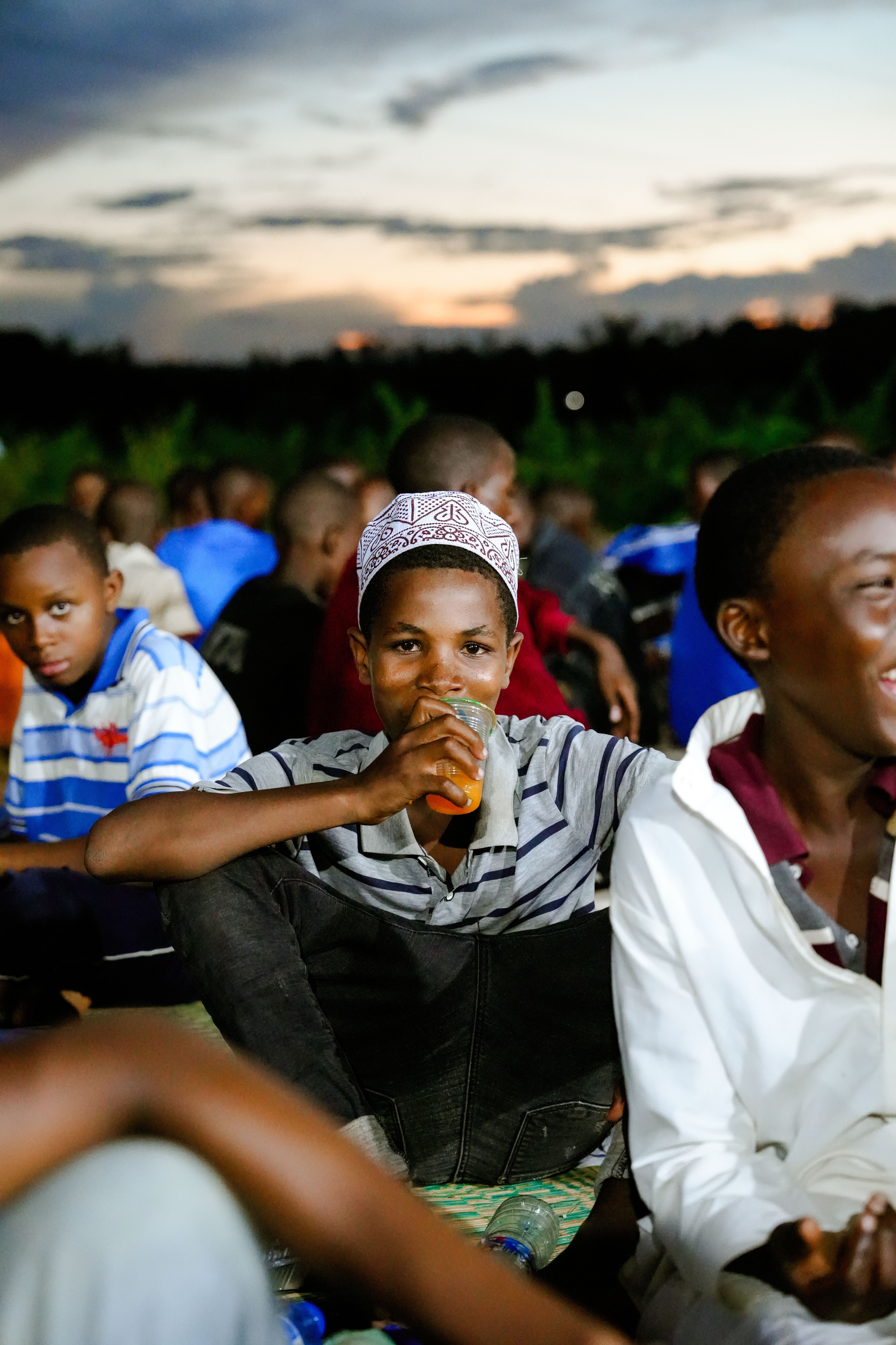 Teenagers Enjoying Outdoor Gathering at Dusk · Free Stock Photo