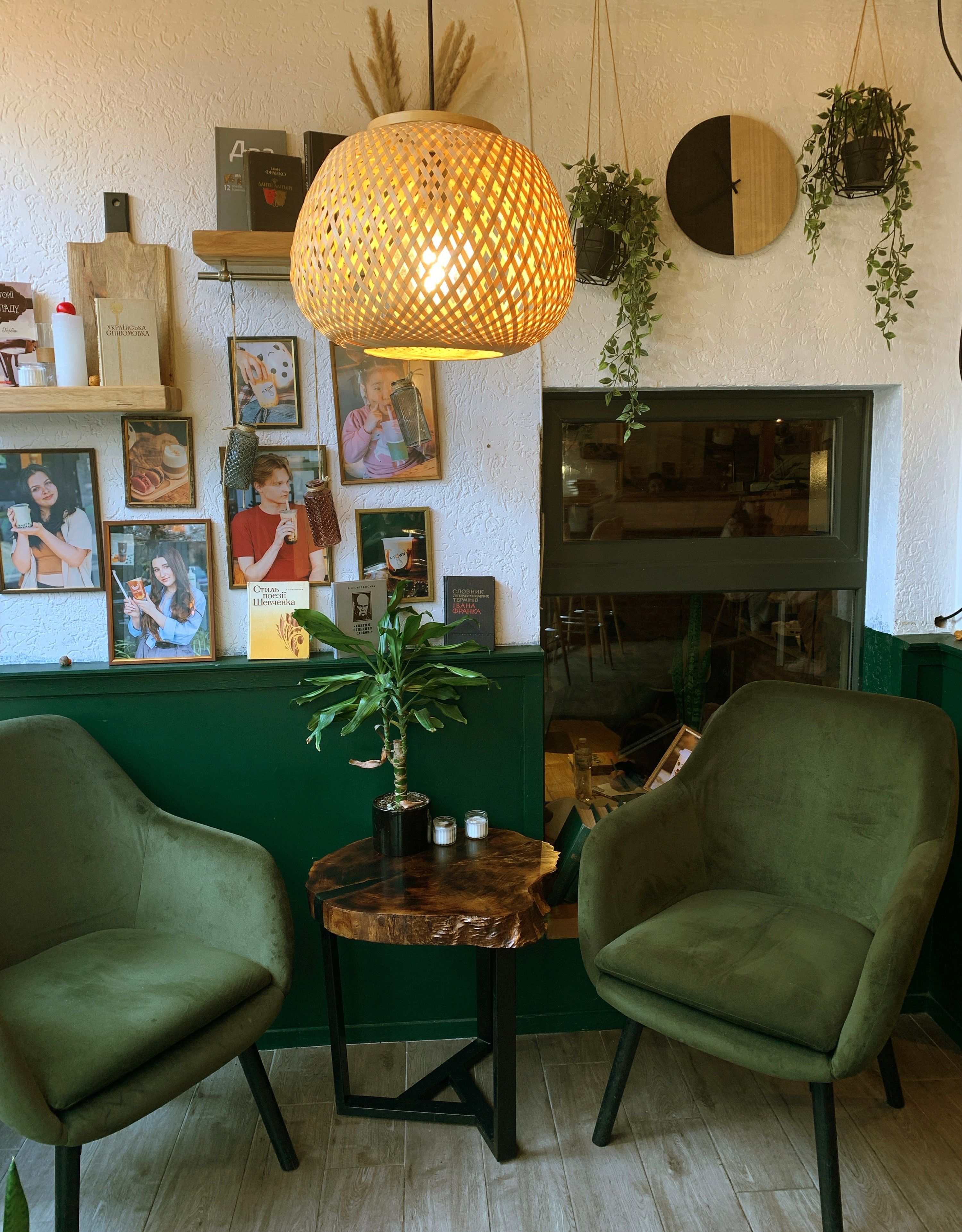 Cozy Indoor Cafe with Green Decor and Wooden Details · Free Stock Photo