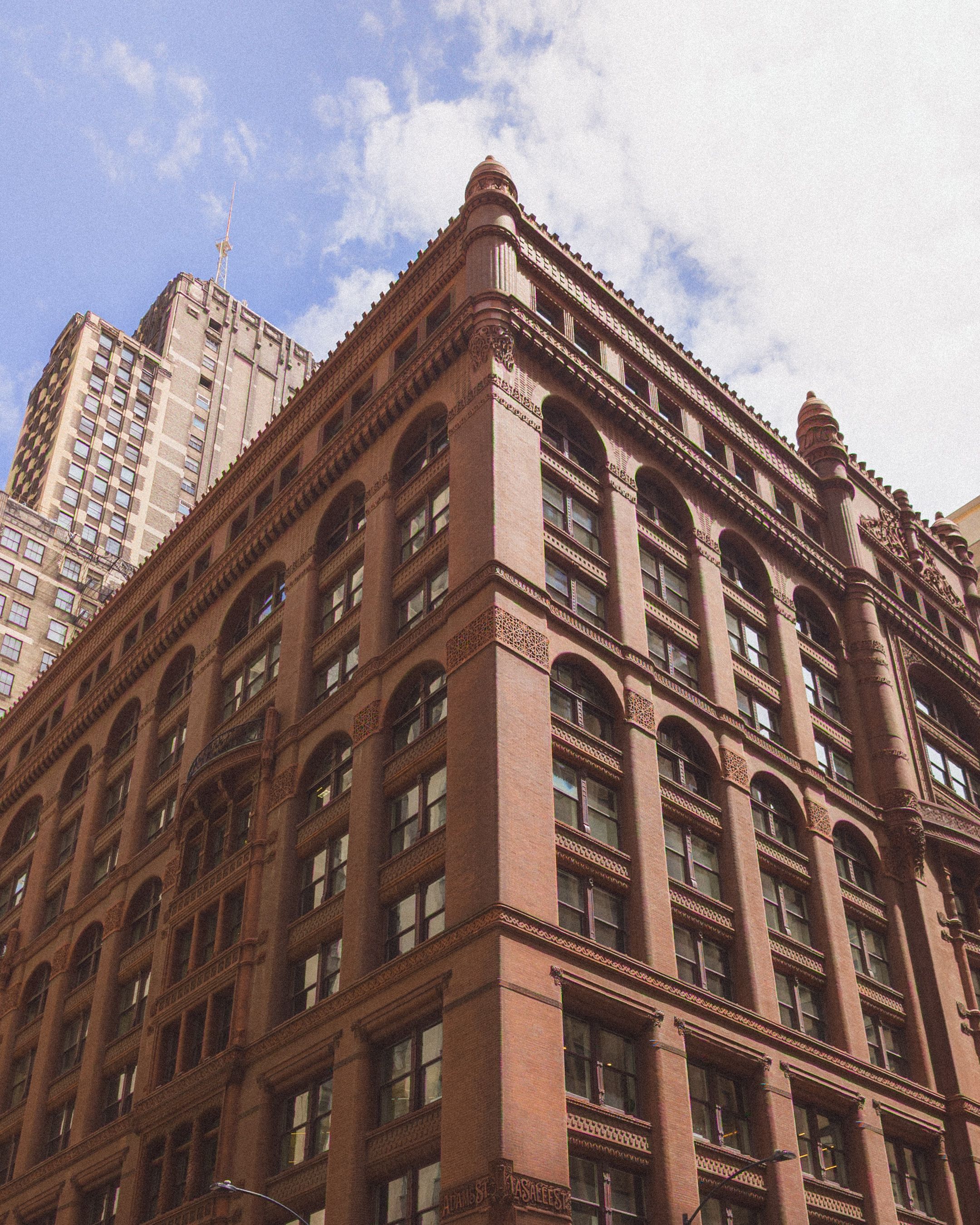 Low Angle Photo of Brown Buildings · Free Stock Photo