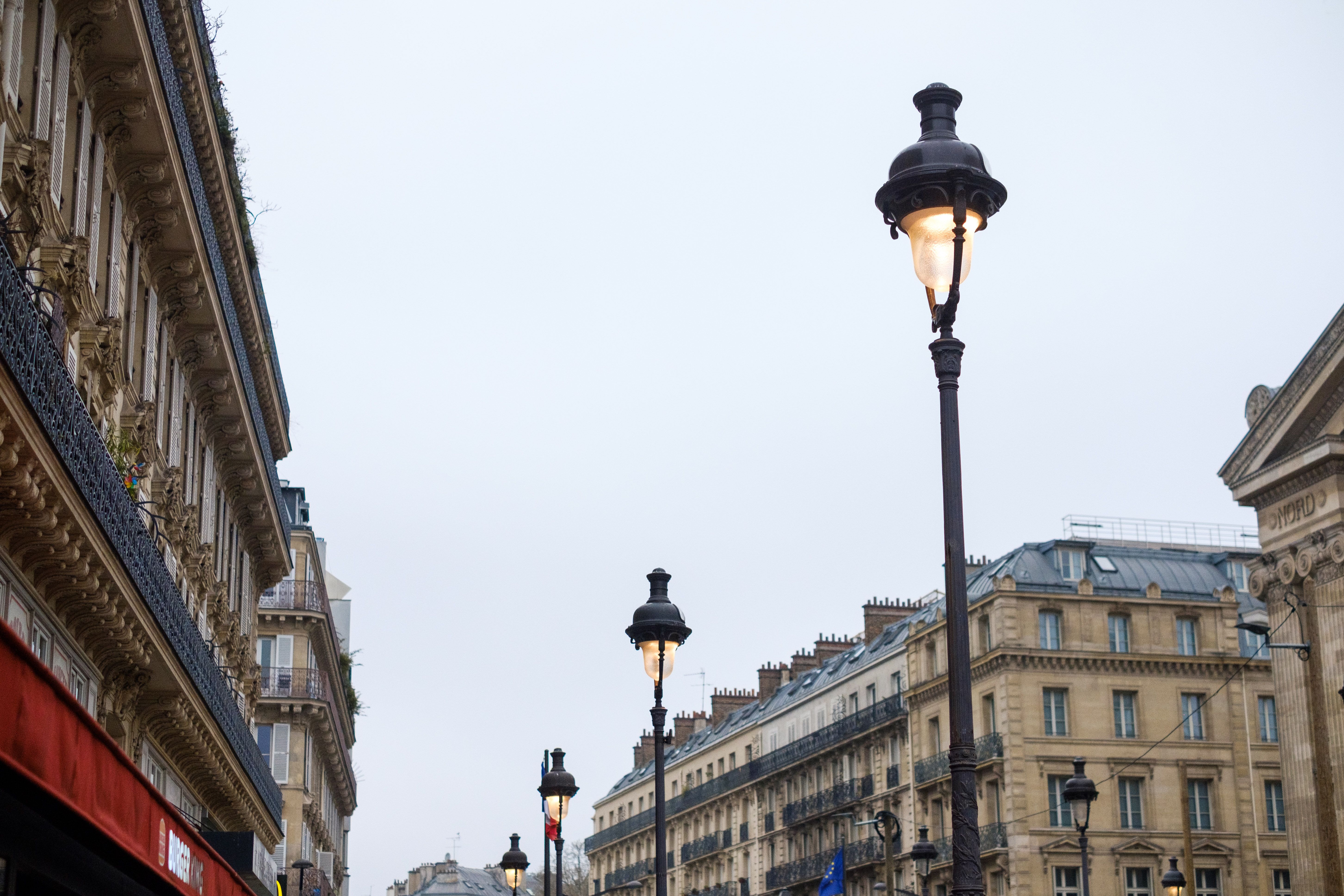 Elegant Parisian Street with Vintage Lamp Posts · Free Stock Photo