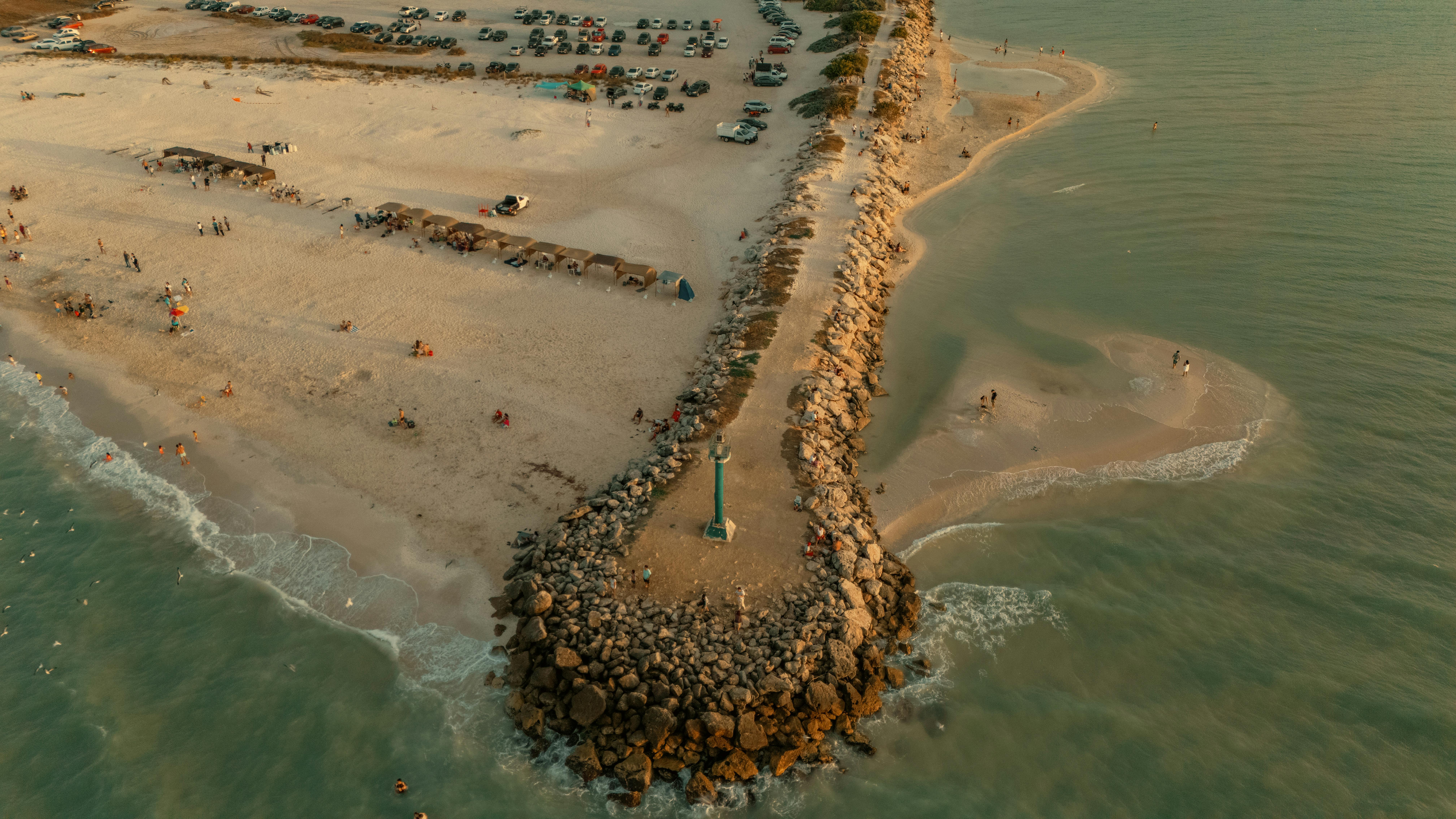 Aerial View of Rocky Jetty on Sandy Beach · Free Stock Photo