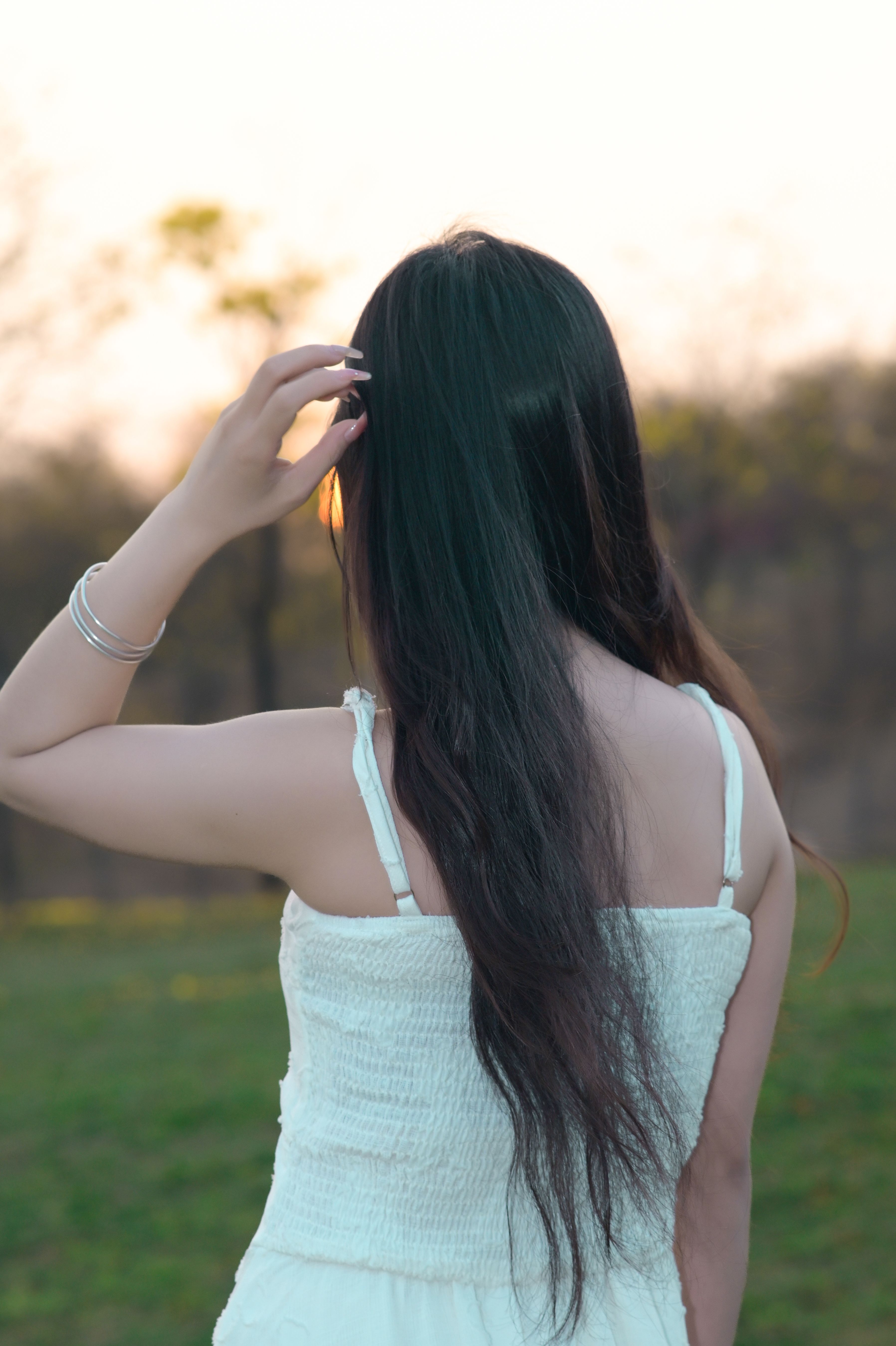 Back View of a Woman in a White Summer Dress · Free Stock Photo