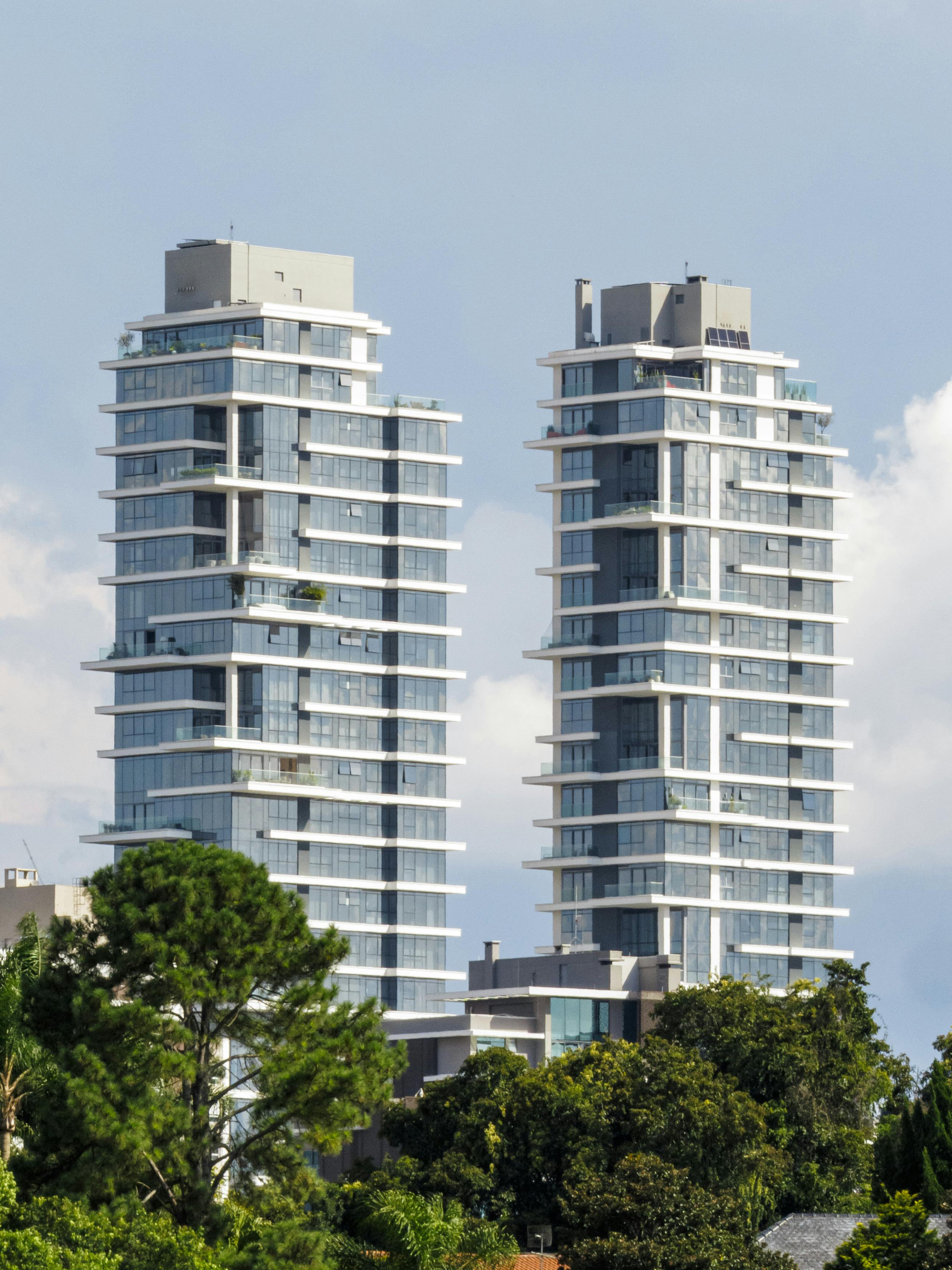 High Rise Buildings Under White Clouds · Free Stock Photo