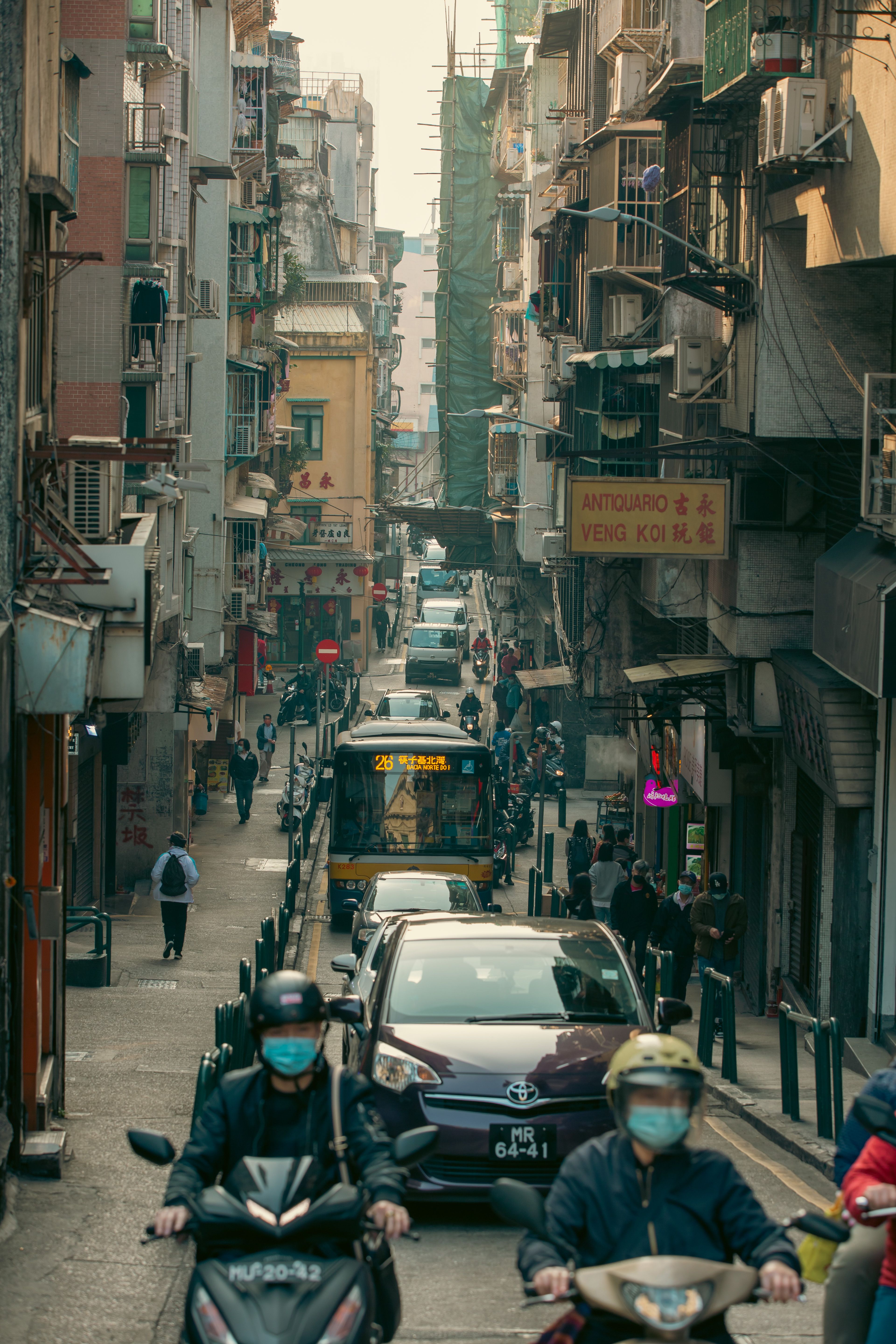 Busy Urban Street Scene with Traffic and Pedestrians · Free Stock Photo