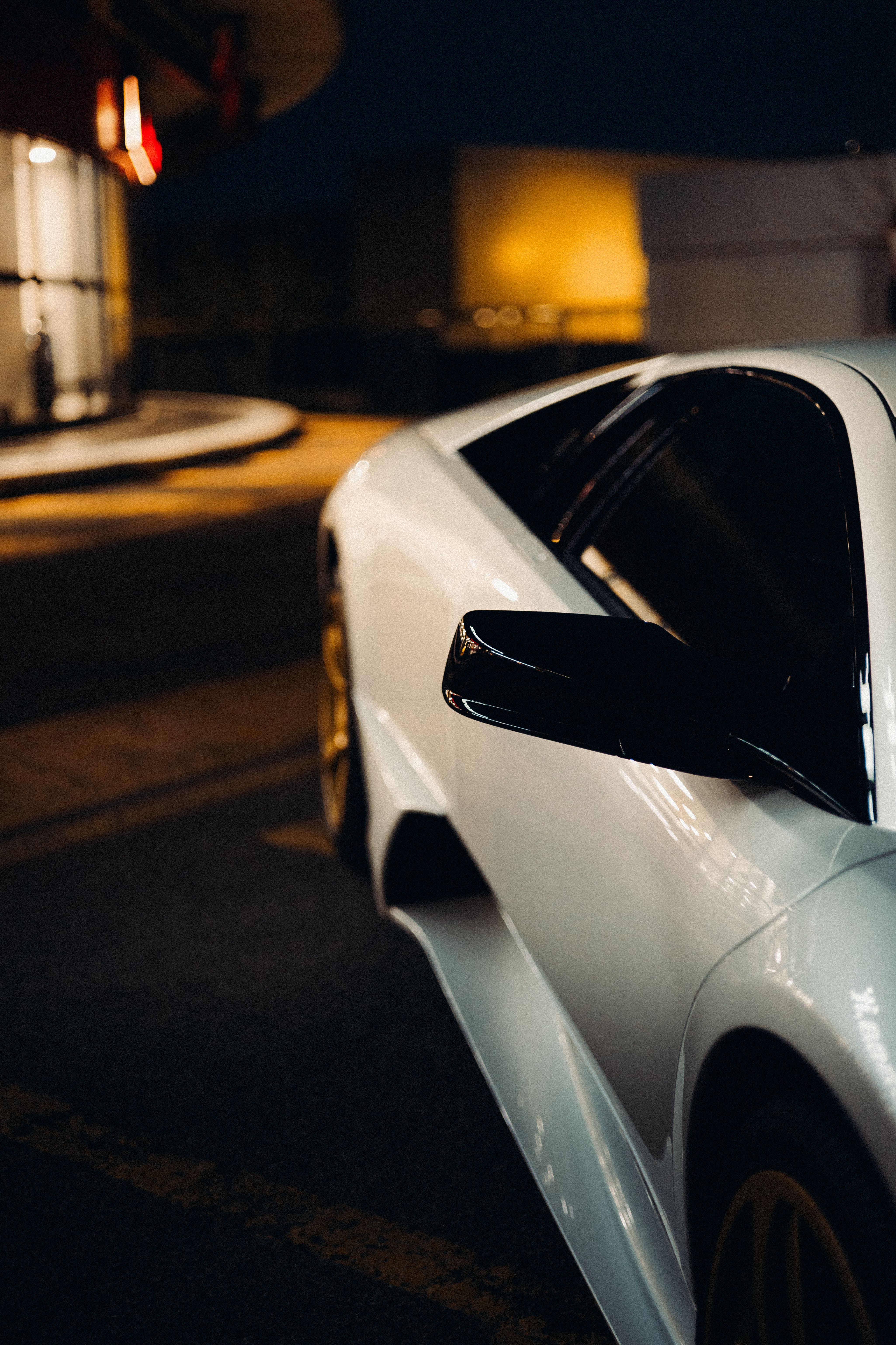 Sleek White Sports Car Parked at Night · Free Stock Photo