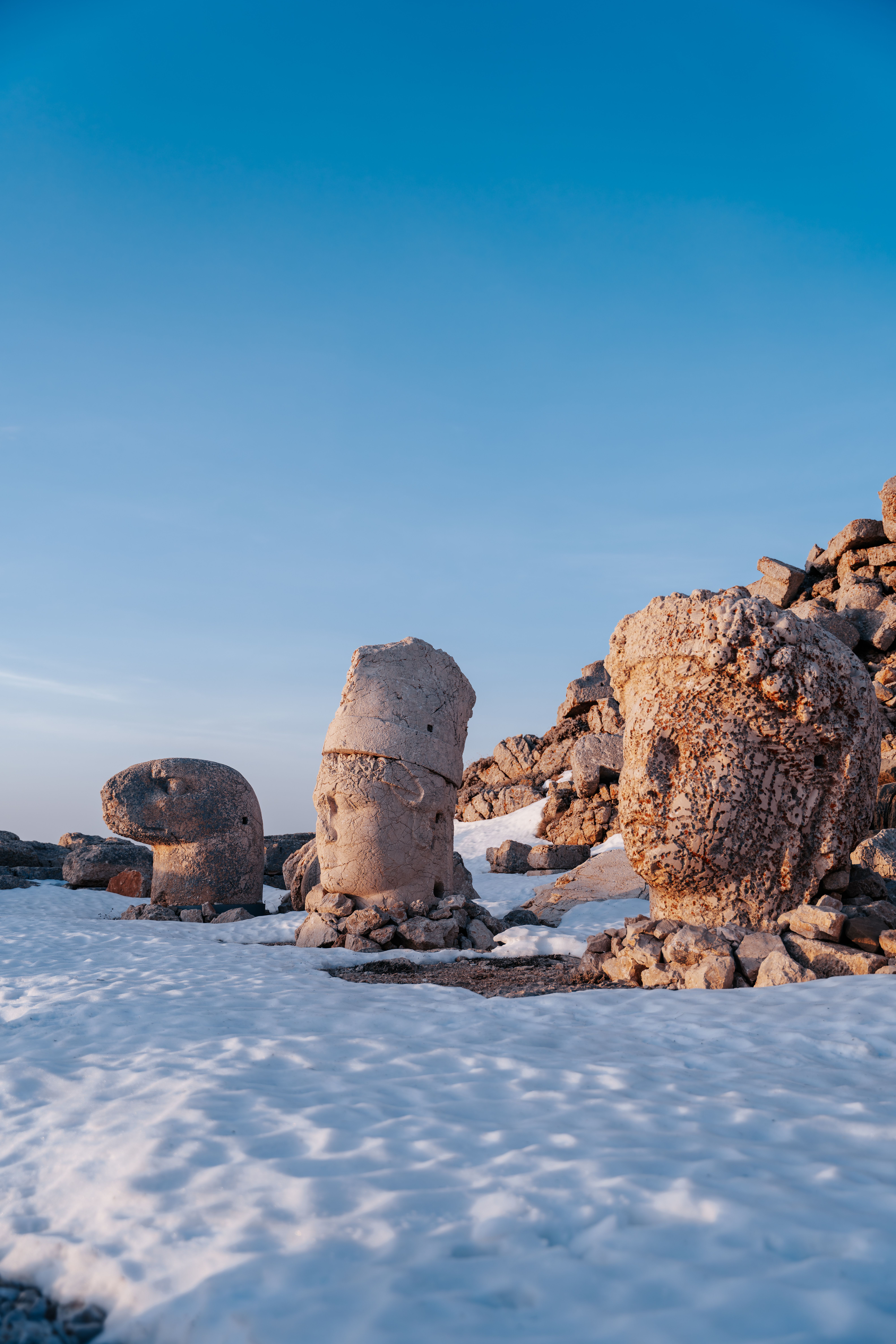 Ancient Sculptures on Snowy Mountaintop · Free Stock Photo