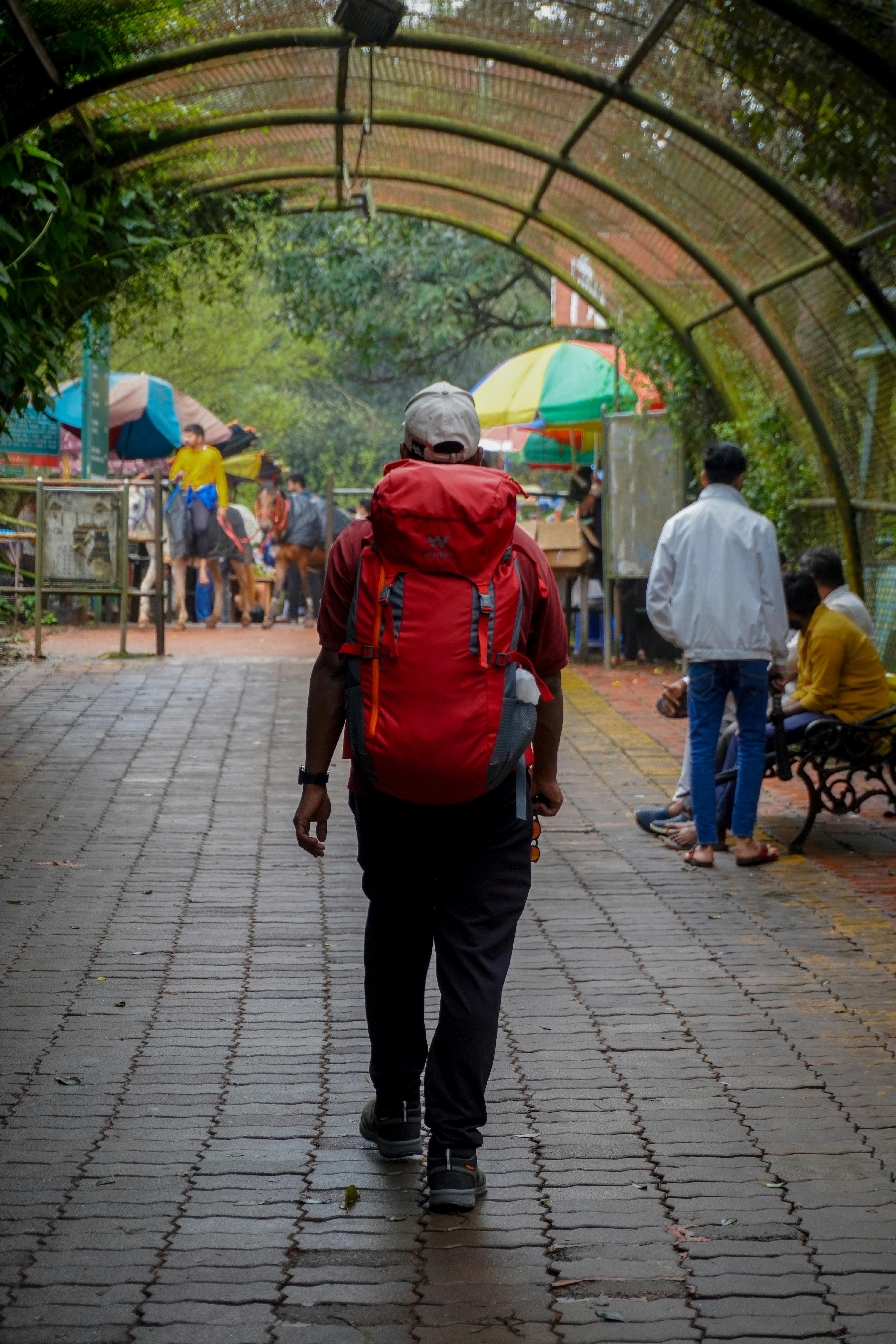 Backpacker Walking Through Matheran Market in India · Free Stock Photo