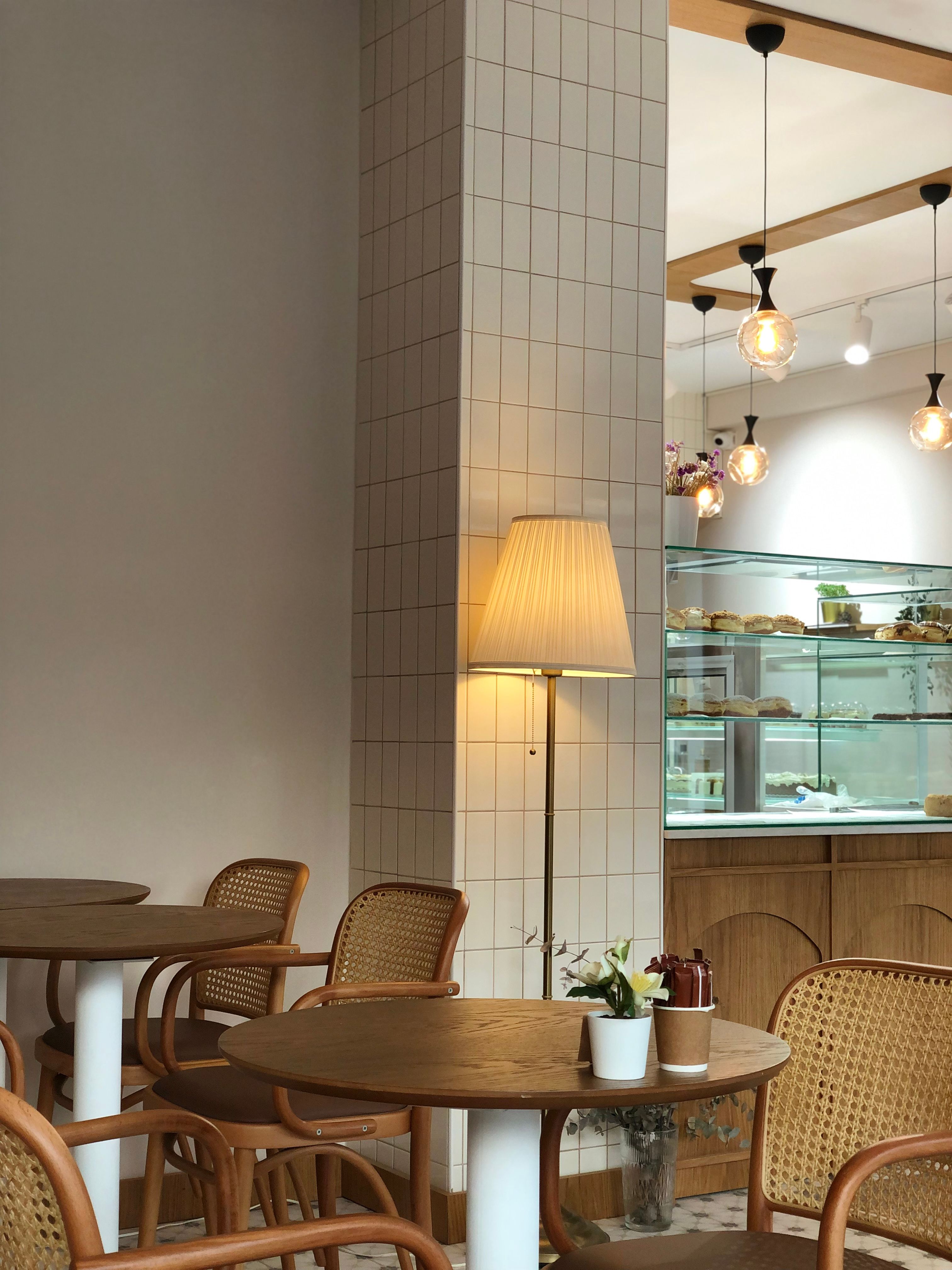 Cozy Café Interior with Wooden Furnishings · Free Stock Photo