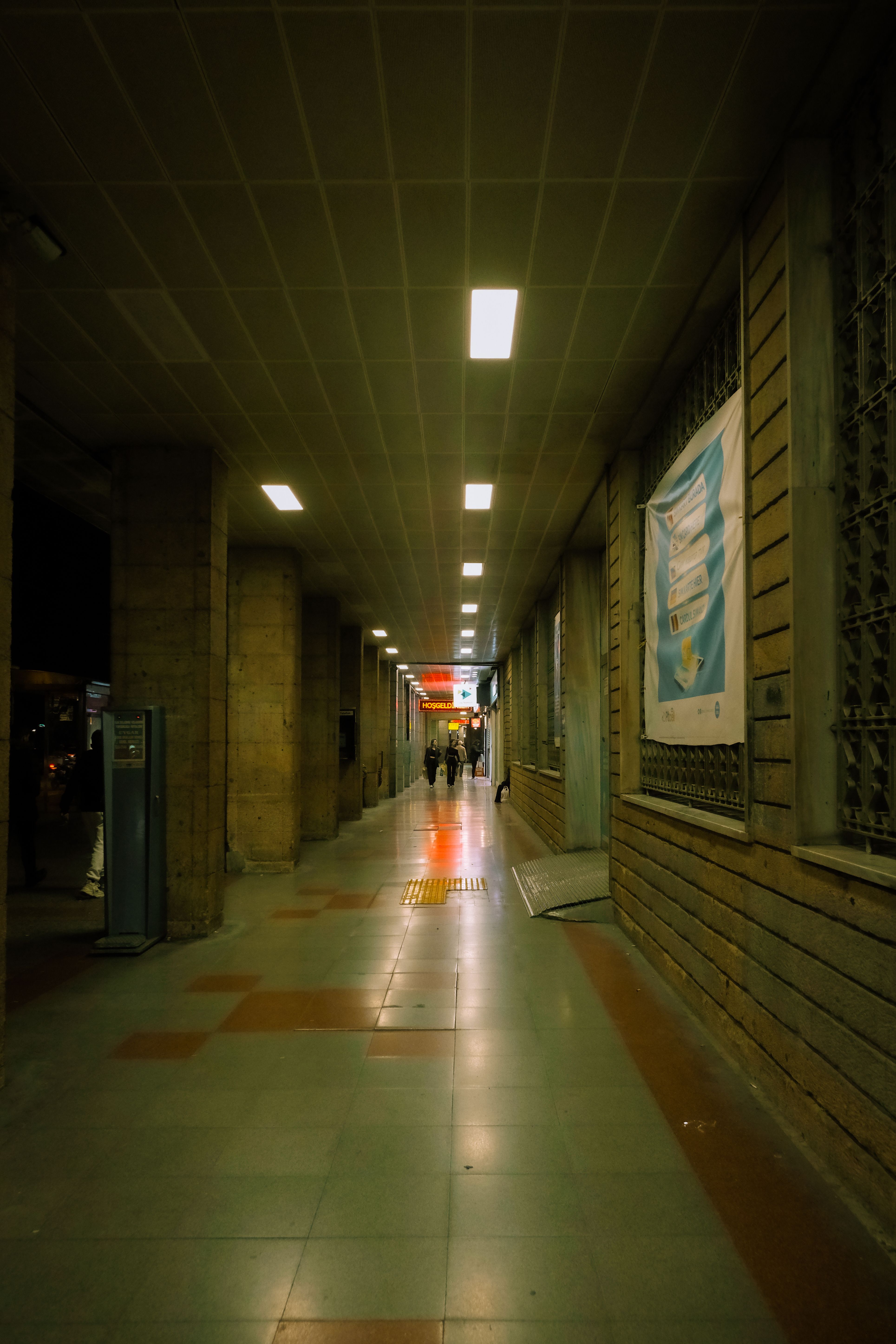 Dimly Lit Urban Corridor at Night · Free Stock Photo