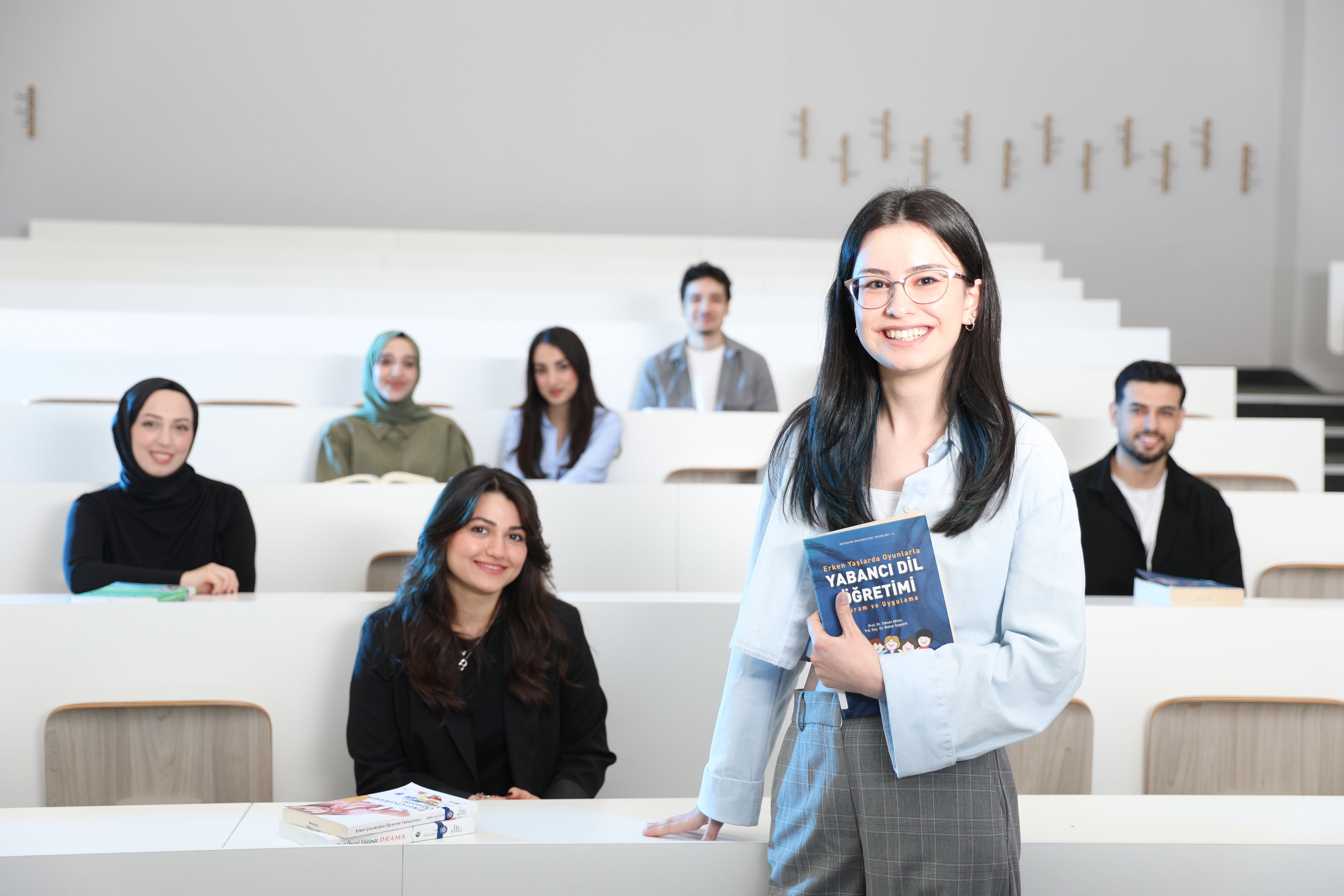 University Students in Lecture Hall with Books · Free Stock Photo