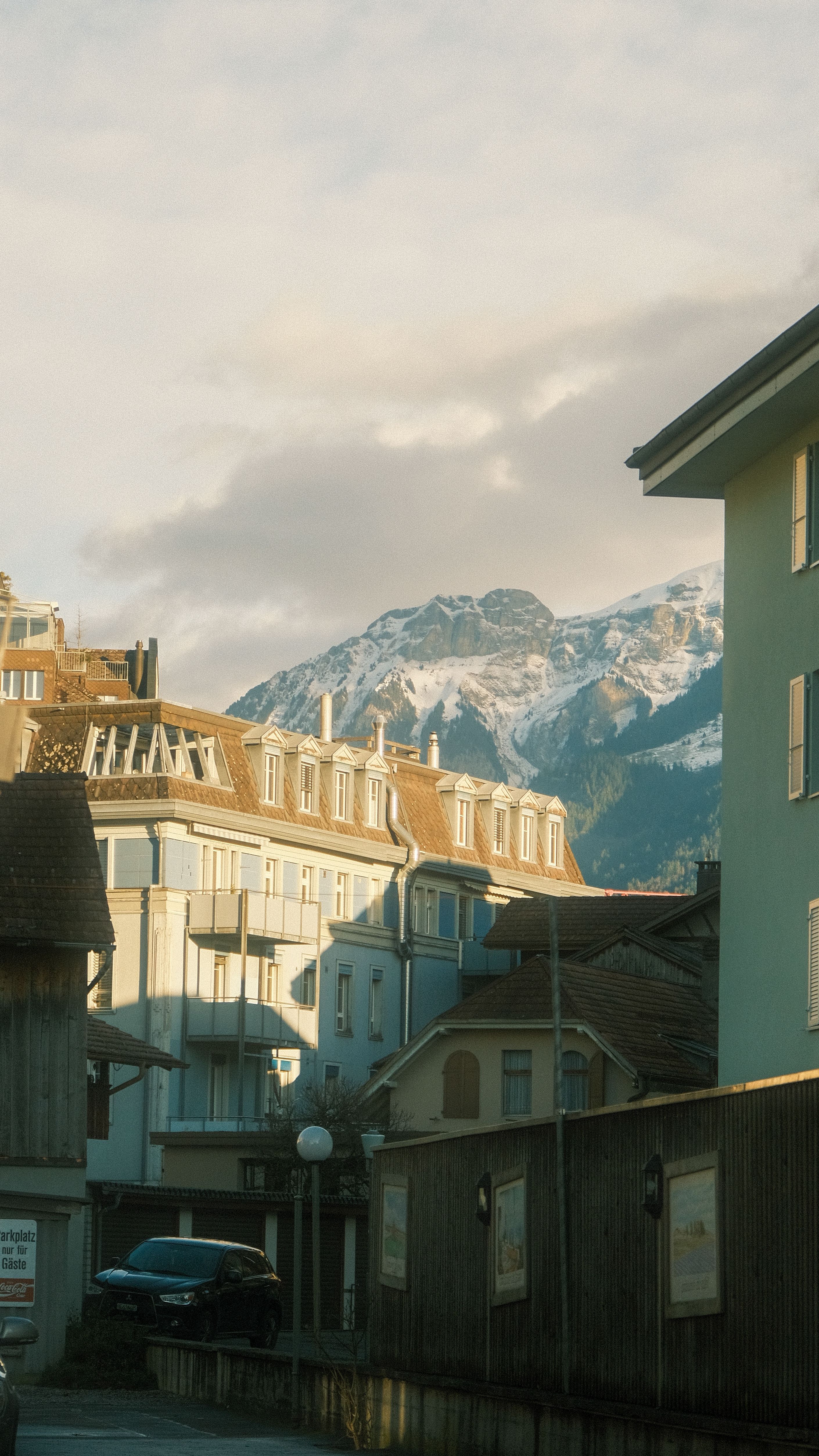 Charming Alpine Town with Mountain View · Free Stock Photo