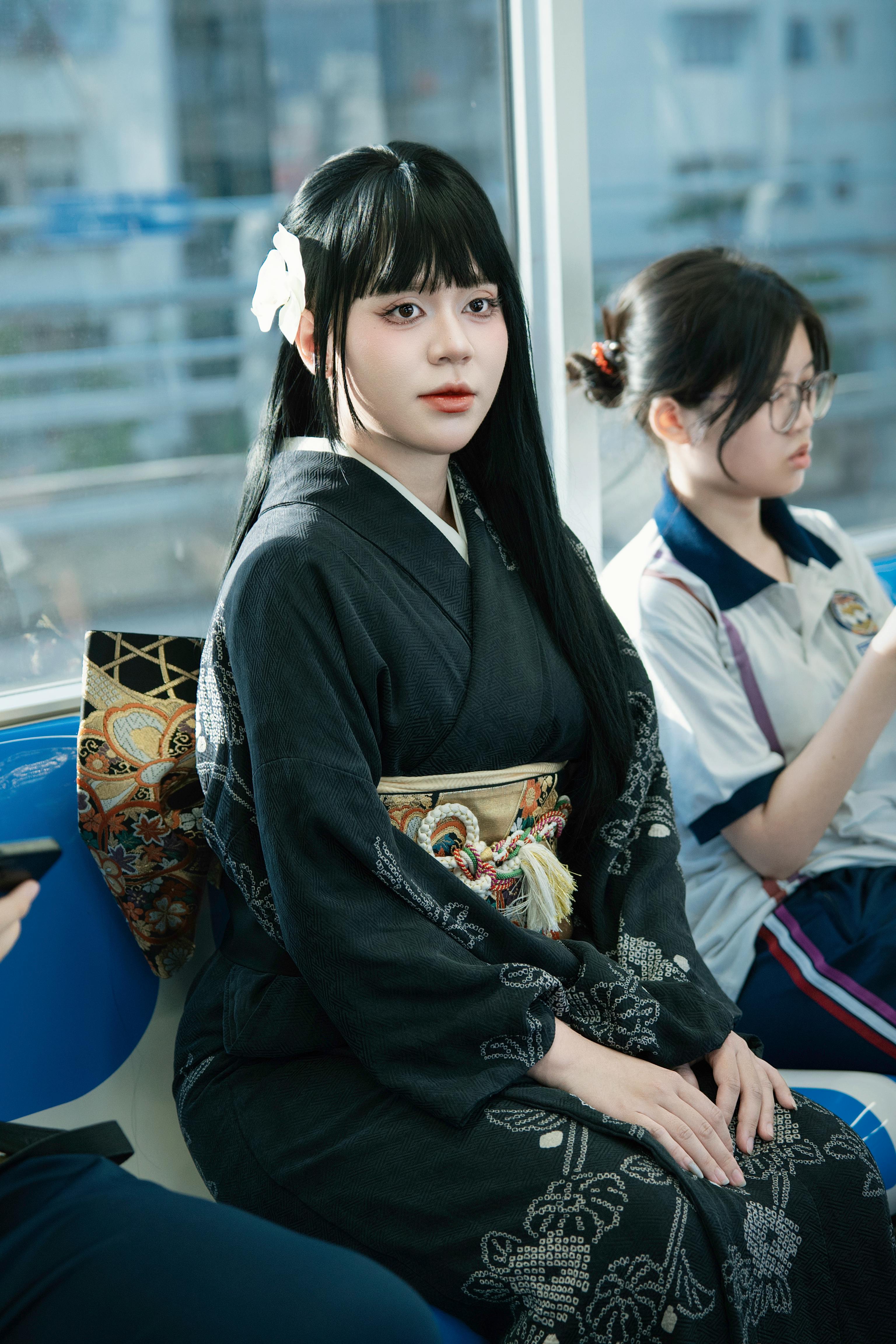 Japanese Woman in Traditional Kimono on Public Transport · Free Stock Photo