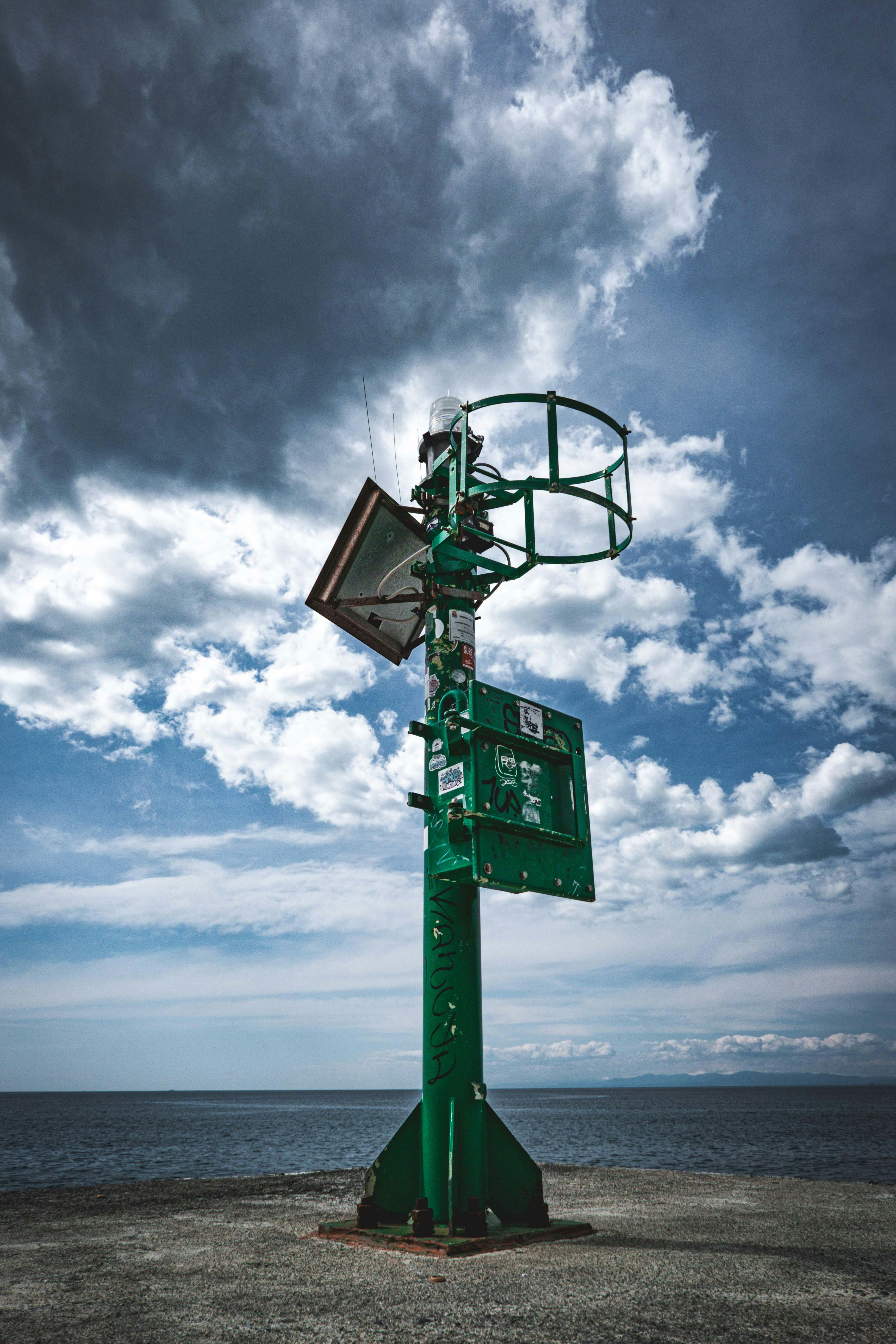 Solitary Marine Navigation Beacon by the Sea · Free Stock Photo