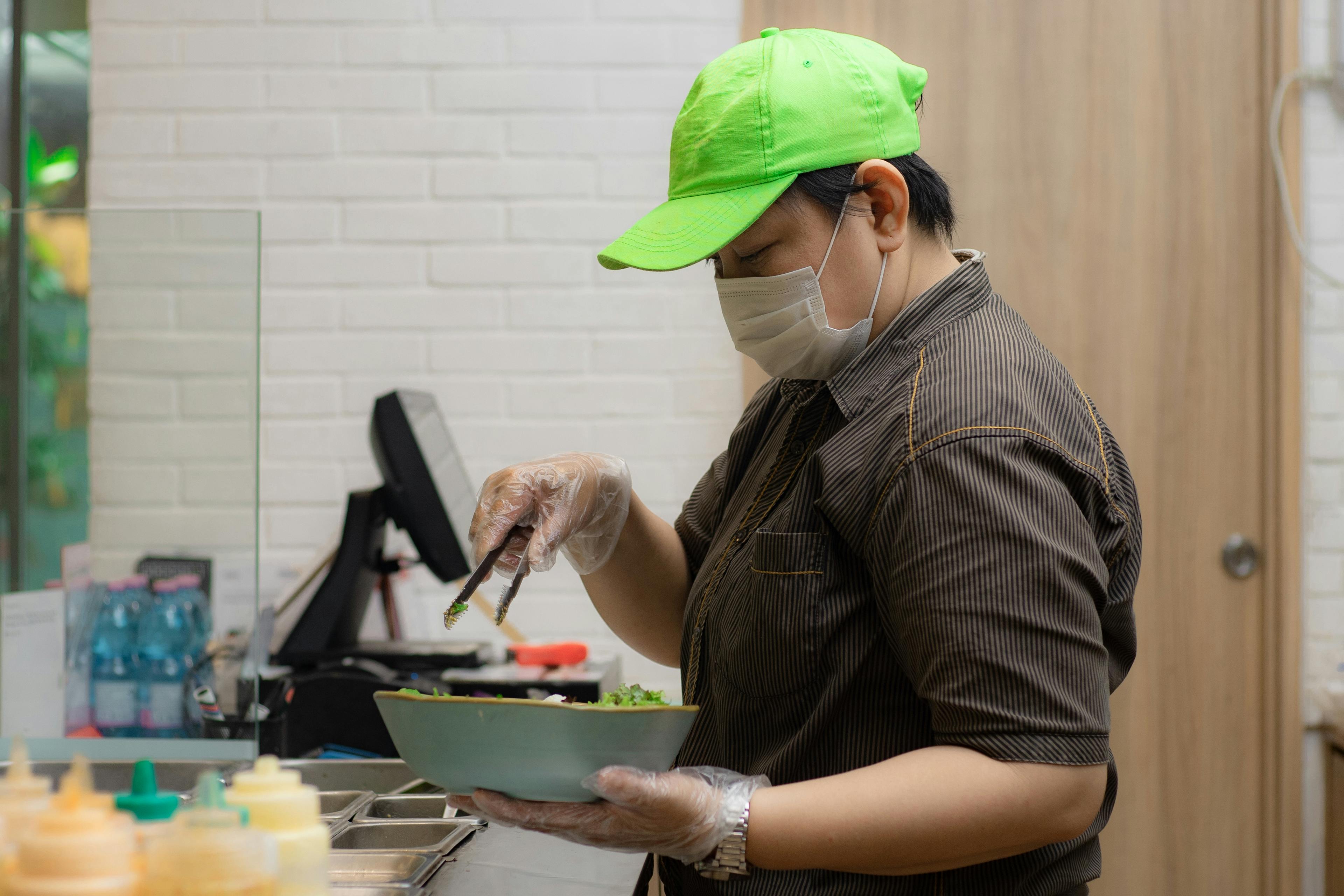 Chef Preparing Salad in a Restaurant Kitchen · Free Stock Photo