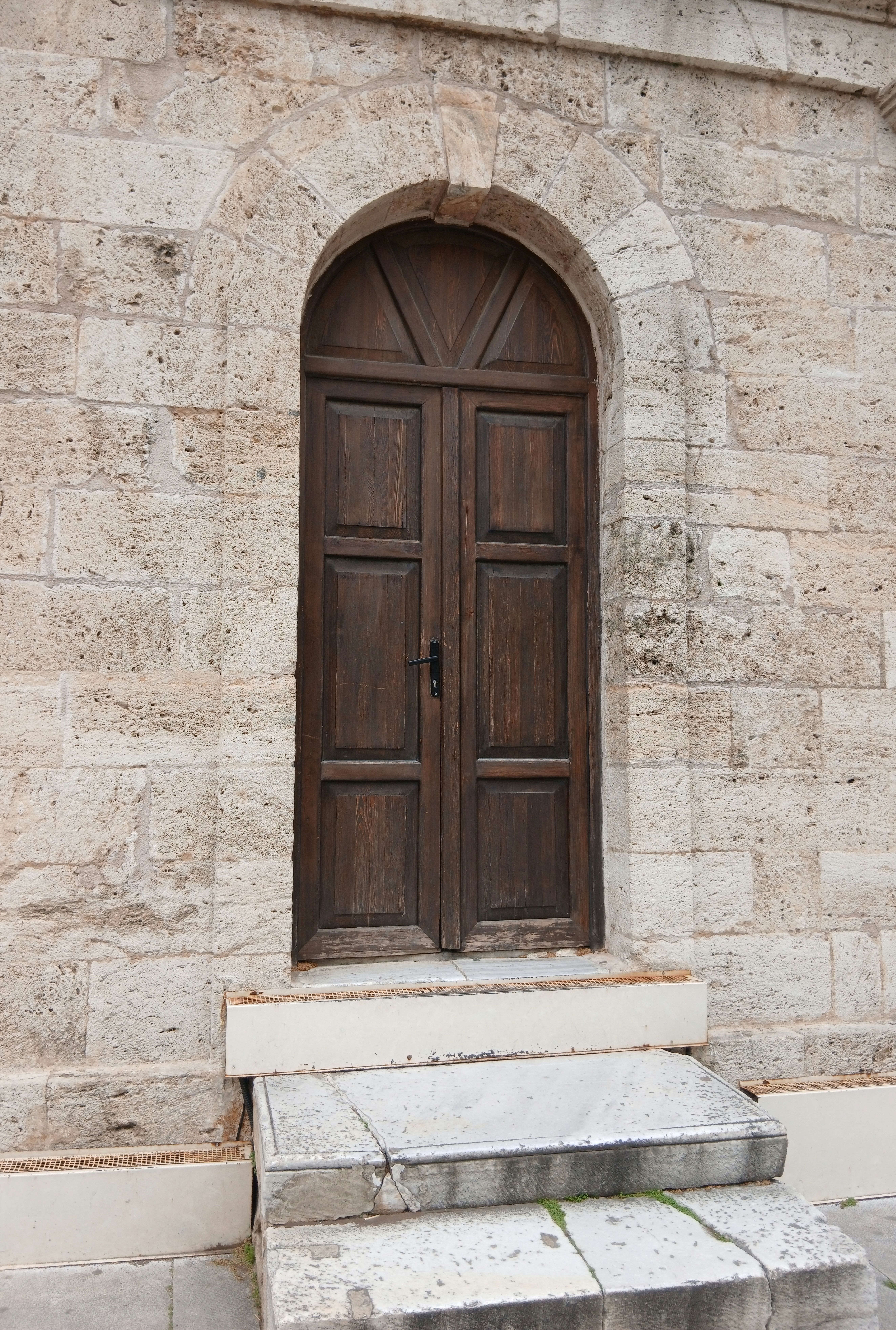 Rustic Wooden Door on Stone Wall Exterior · Free Stock Photo