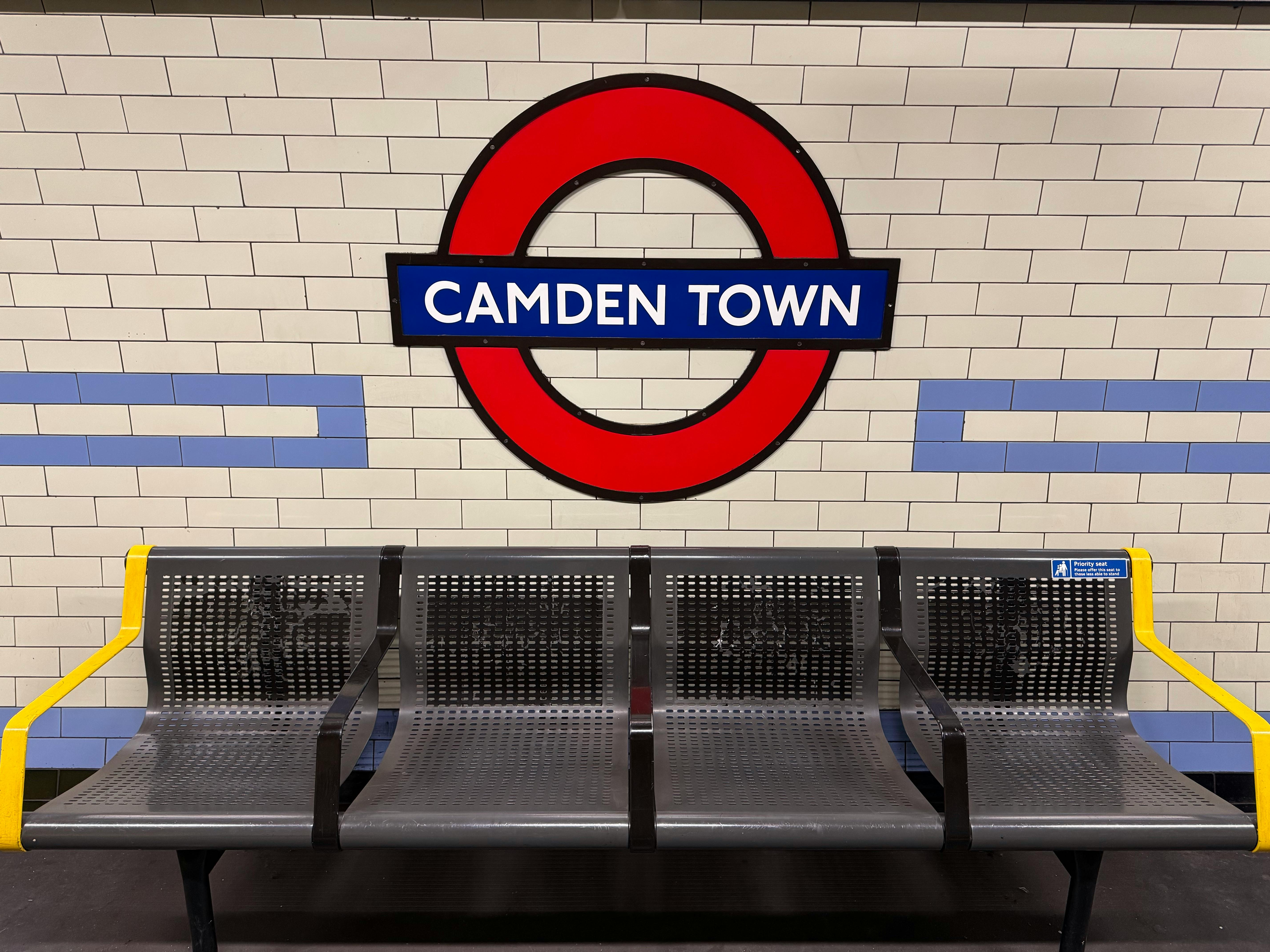 Camden Town Tube Station Sign with Bench · Free Stock Photo