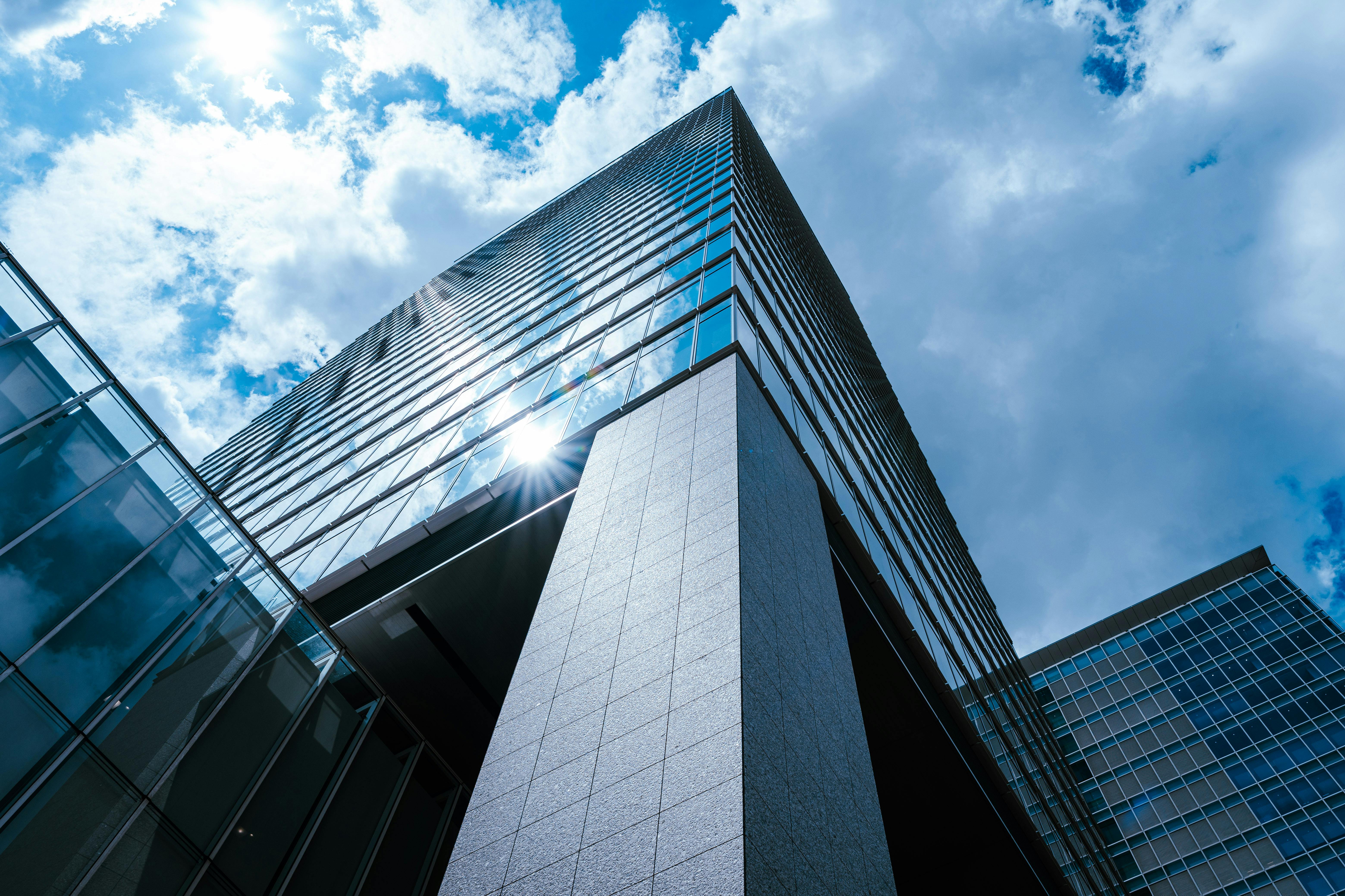 Glass Building Panels Under Blue Sky · Free Stock Photo