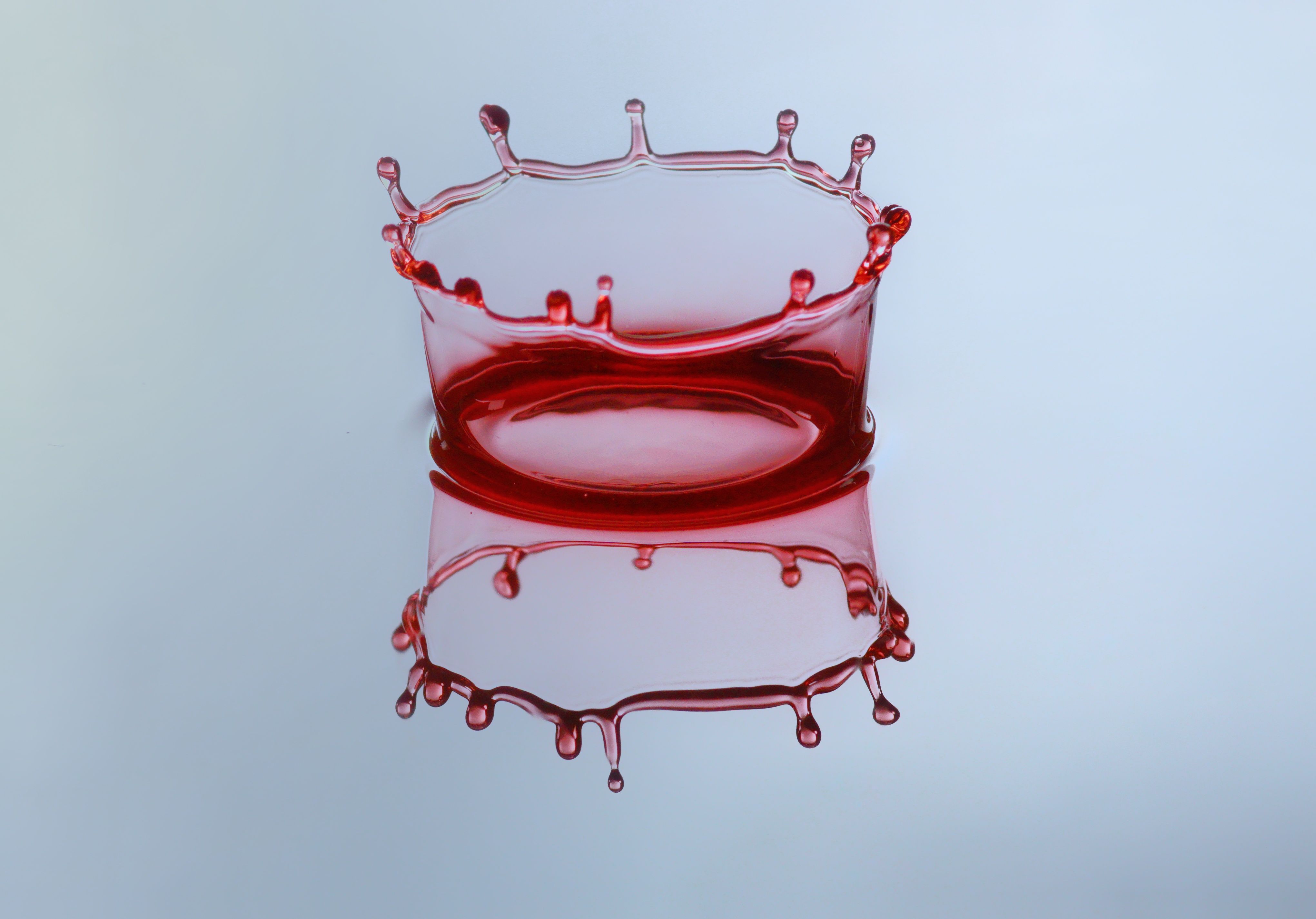 High-Speed Red Liquid Splash Photography · Free Stock Photo