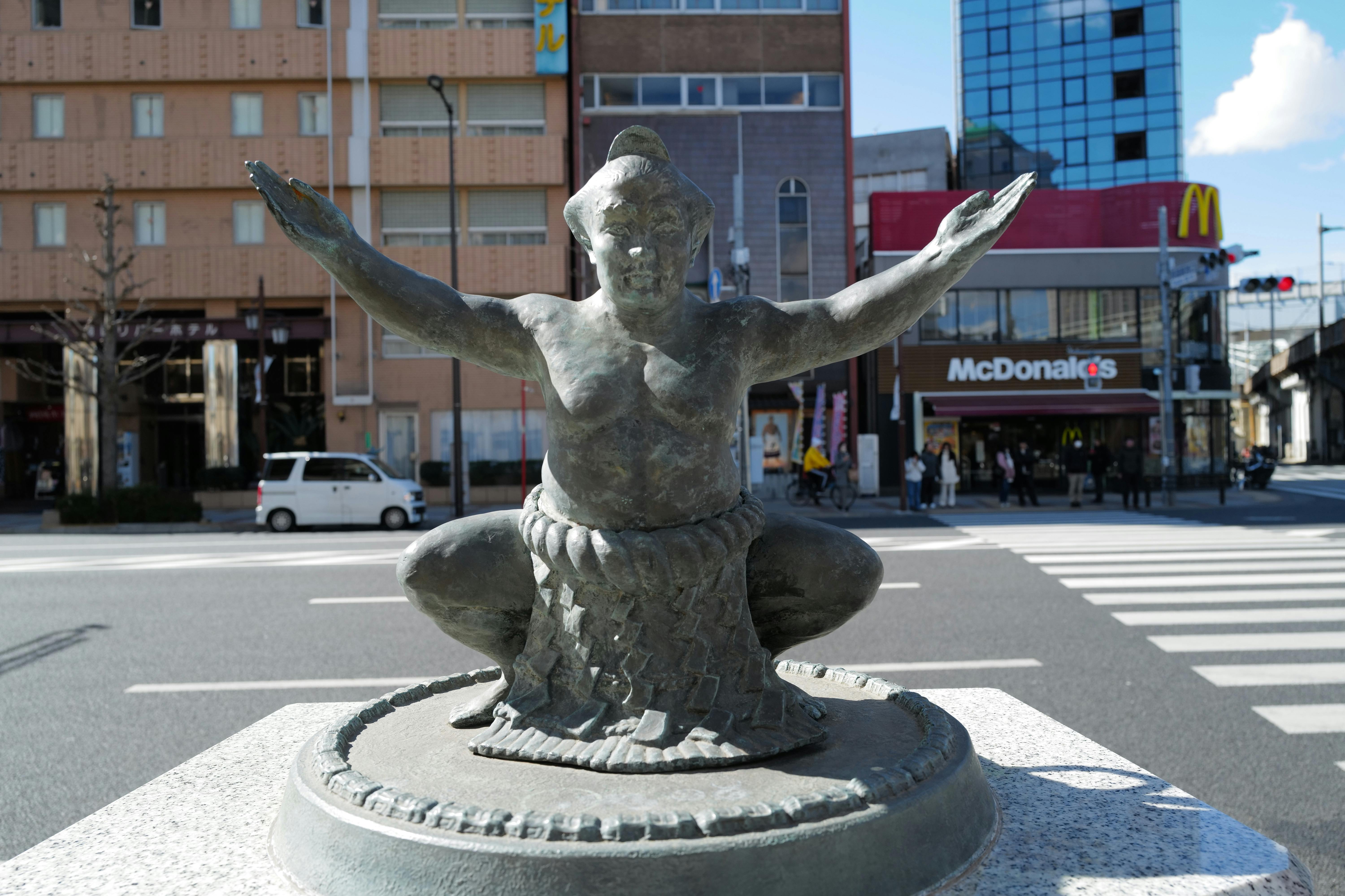 Sumo Wrestler Statue in Urban Cityscape · Free Stock Photo