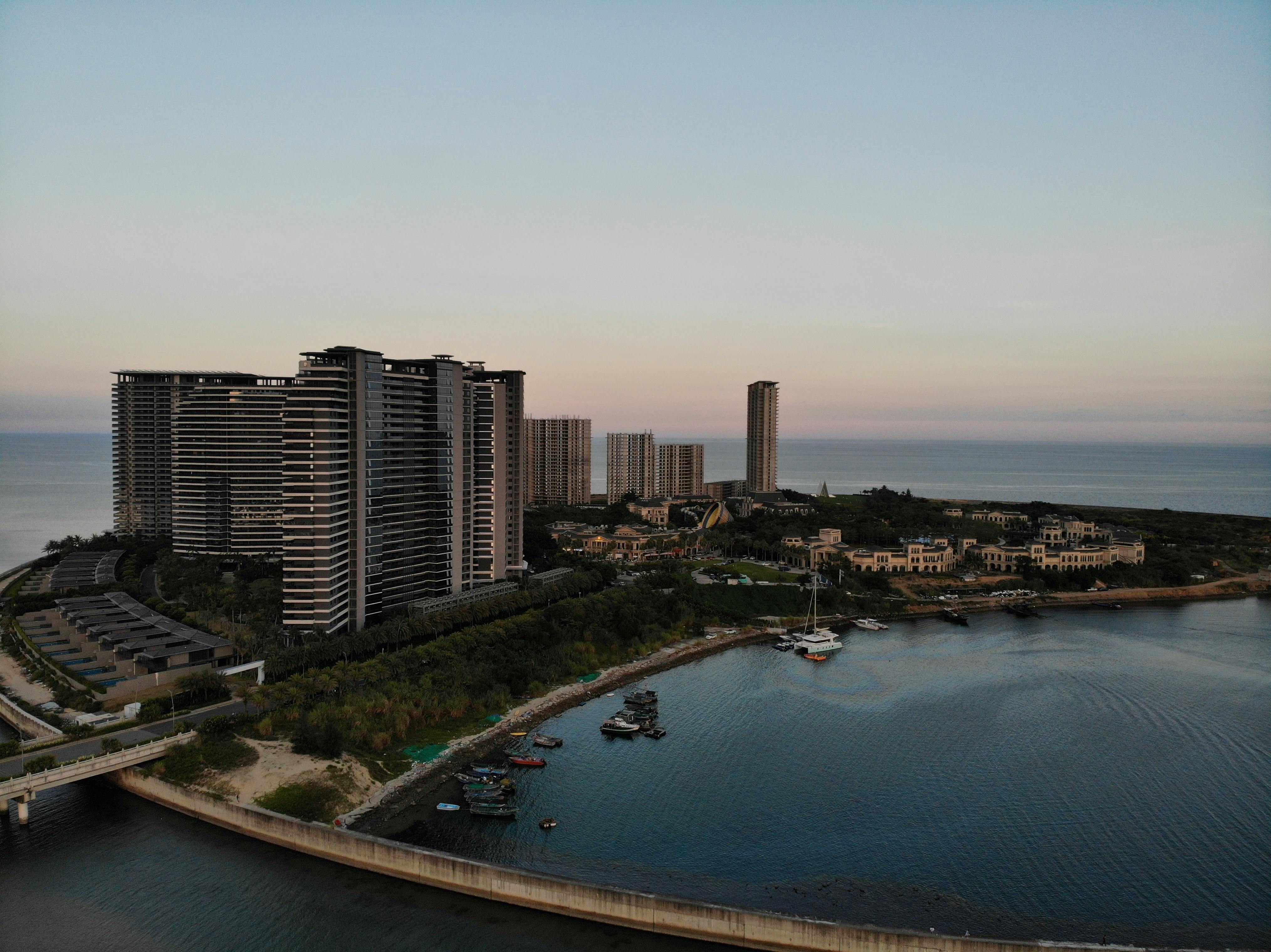 Aerial View of Coastal High-Rise Buildings at Sunset · Free Stock Photo