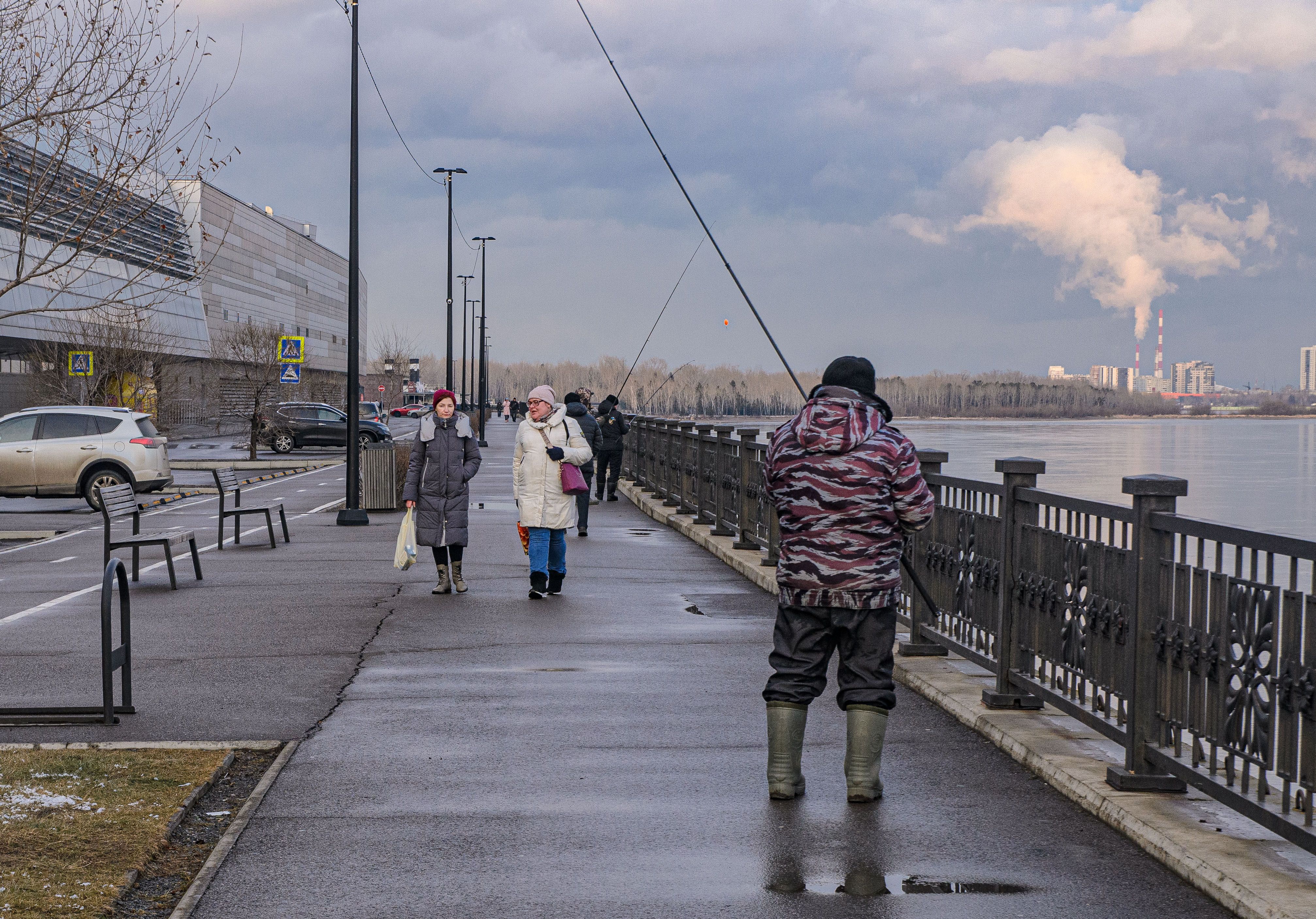 Urban Winter Riverside Walk with Fisherman · Free Stock Photo