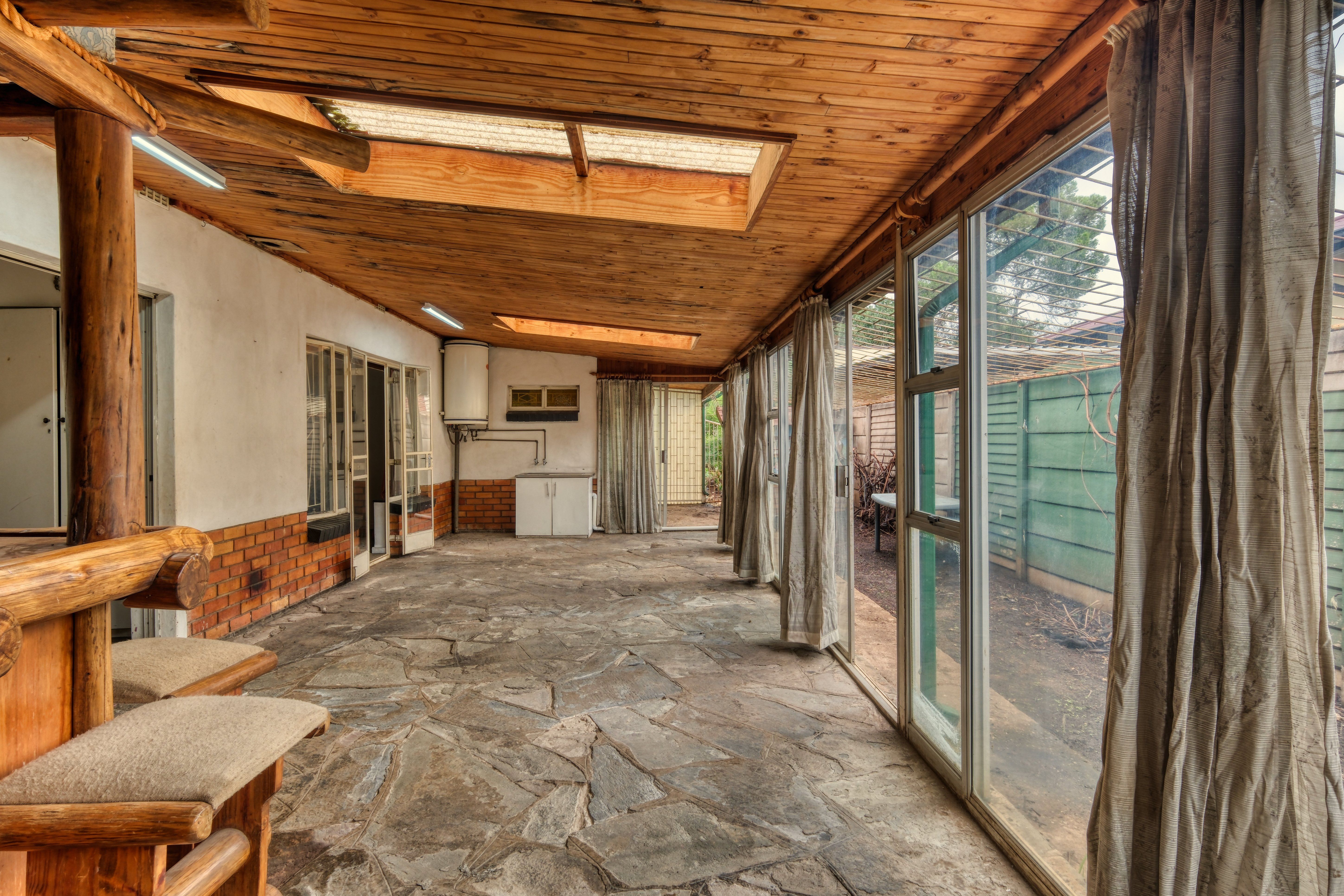 Spacious Rustic Interior with Exposed Wood and Stone · Free Stock Photo
