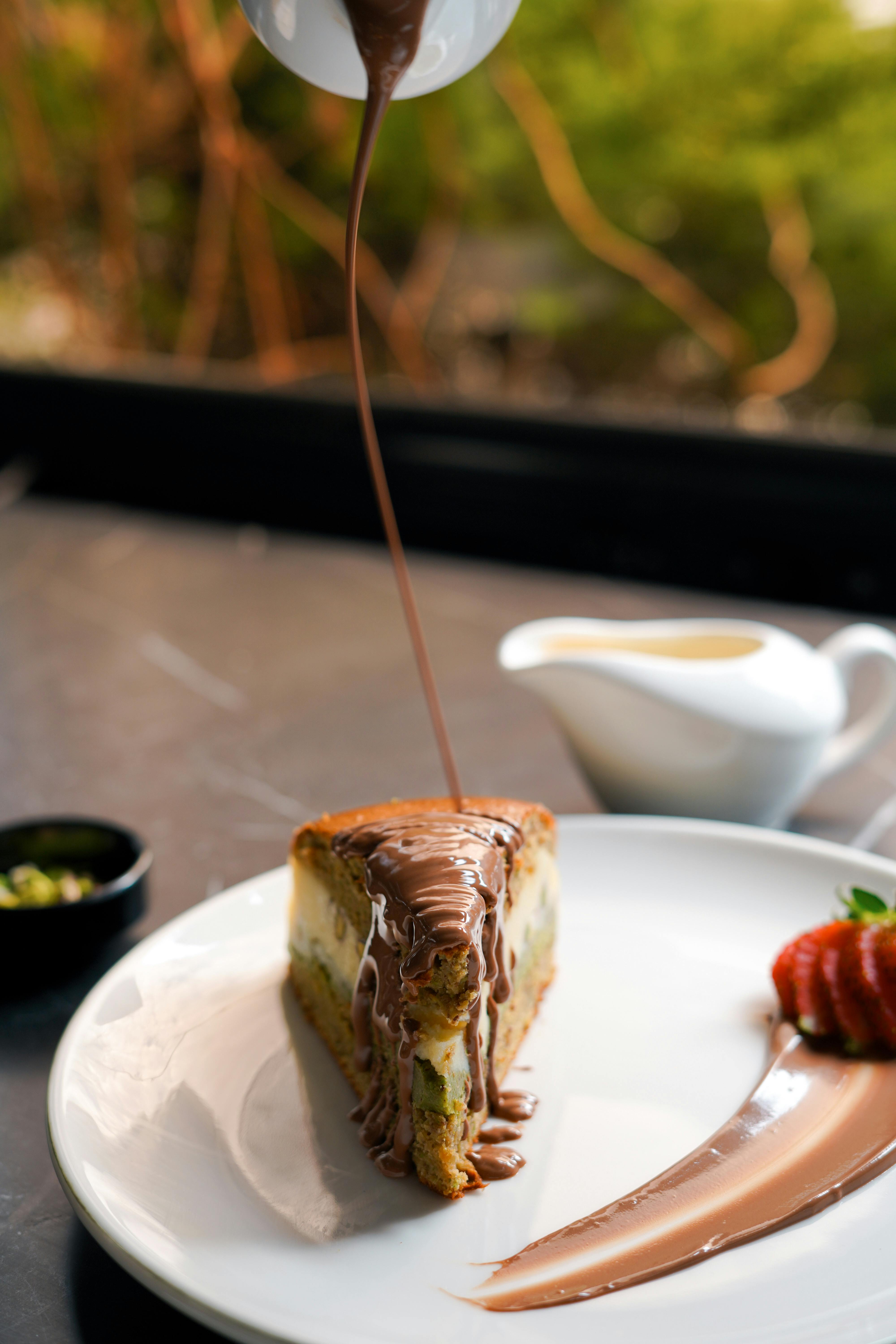 Indulgent Chocolate Drizzled Cheesecake Slice · Free Stock Photo