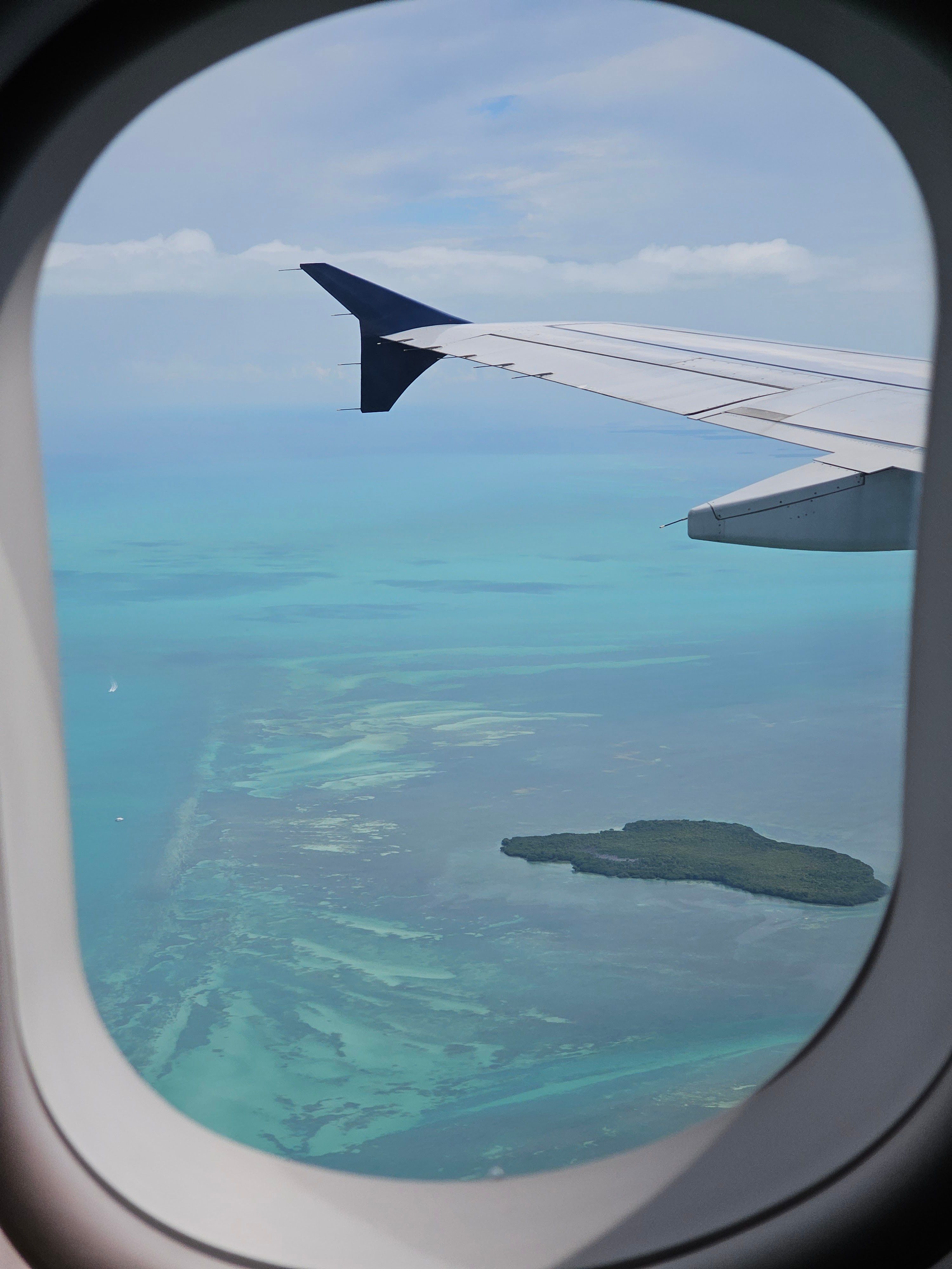 Body of Water View from Airplane Window · Free Stock Photo