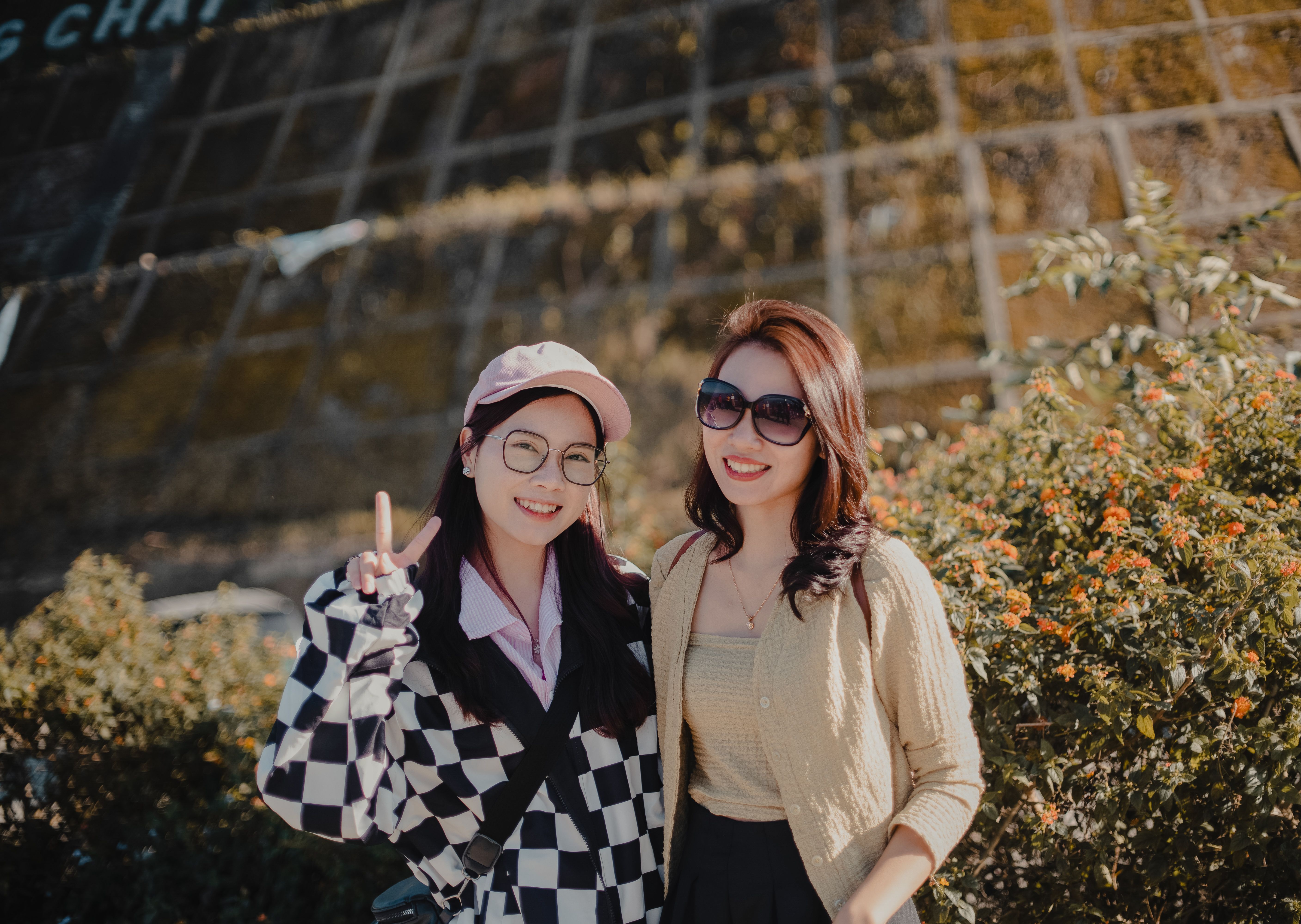Smiling Women Posing Outdoors in Sunny Weather · Free Stock Photo