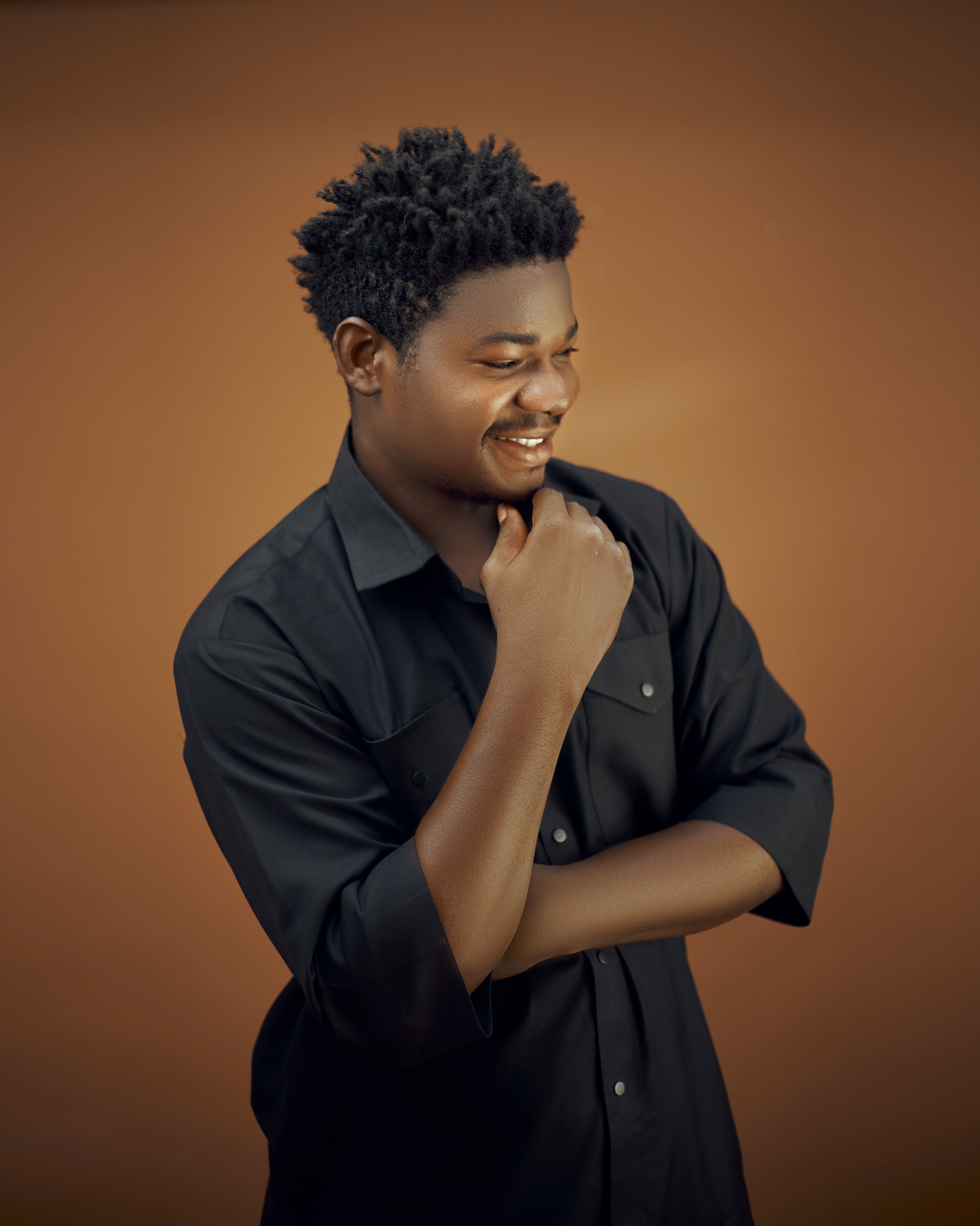 Male Portrait on Warm Background · Free Stock Photo