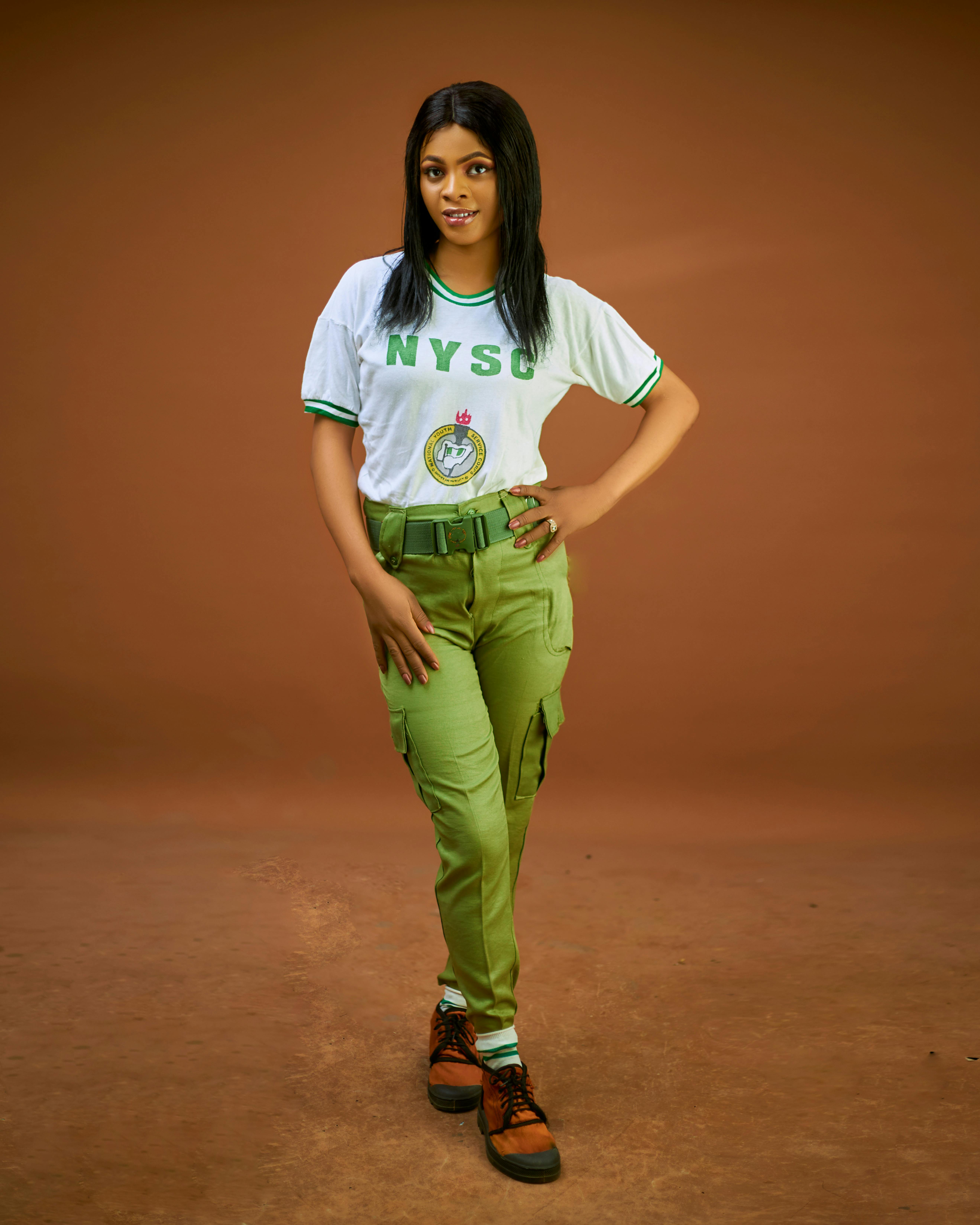 Portrait of Young Woman in NYSC Uniform · Free Stock Photo