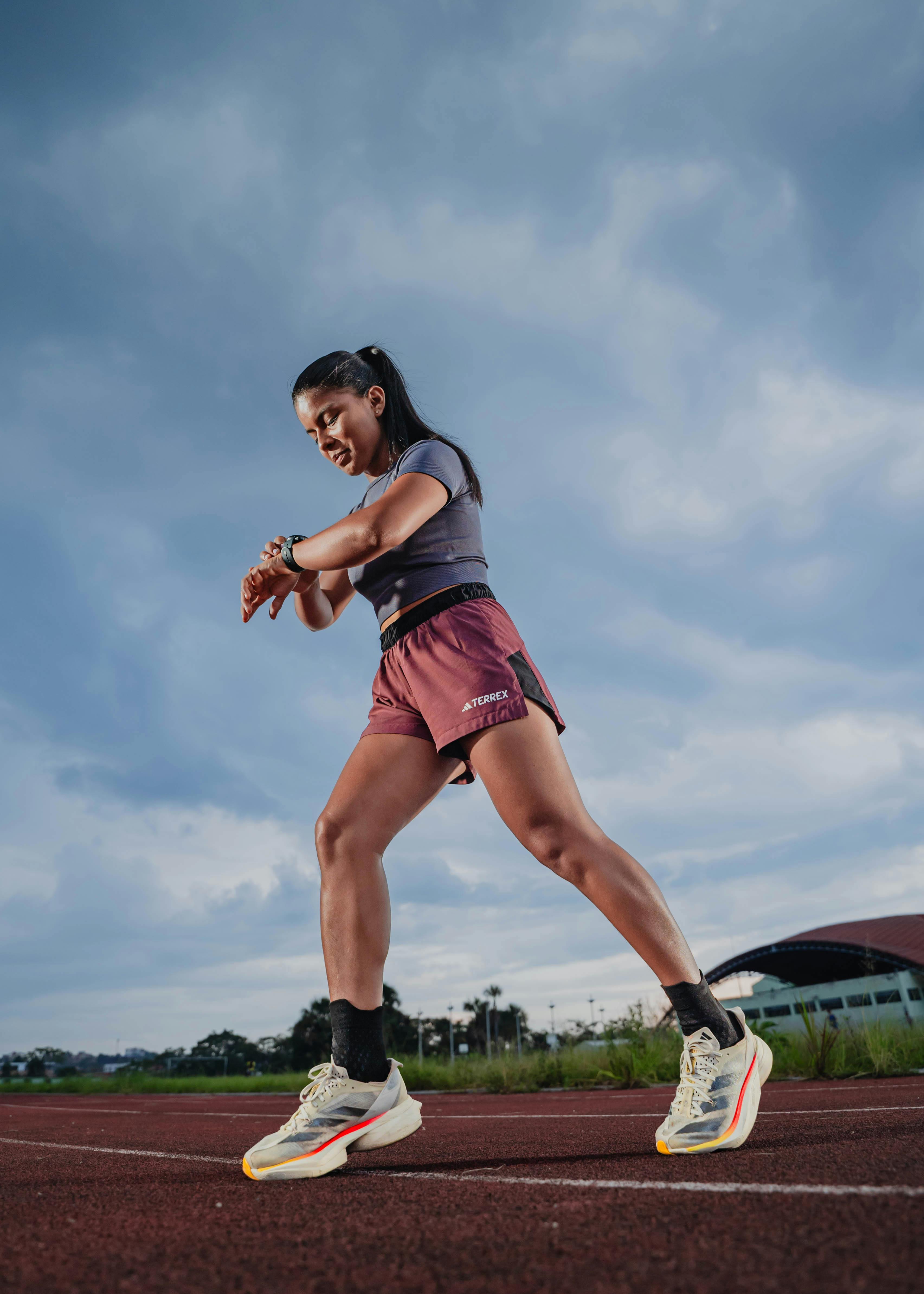 Young Athlete Running on Track in Peru · Free Stock Photo