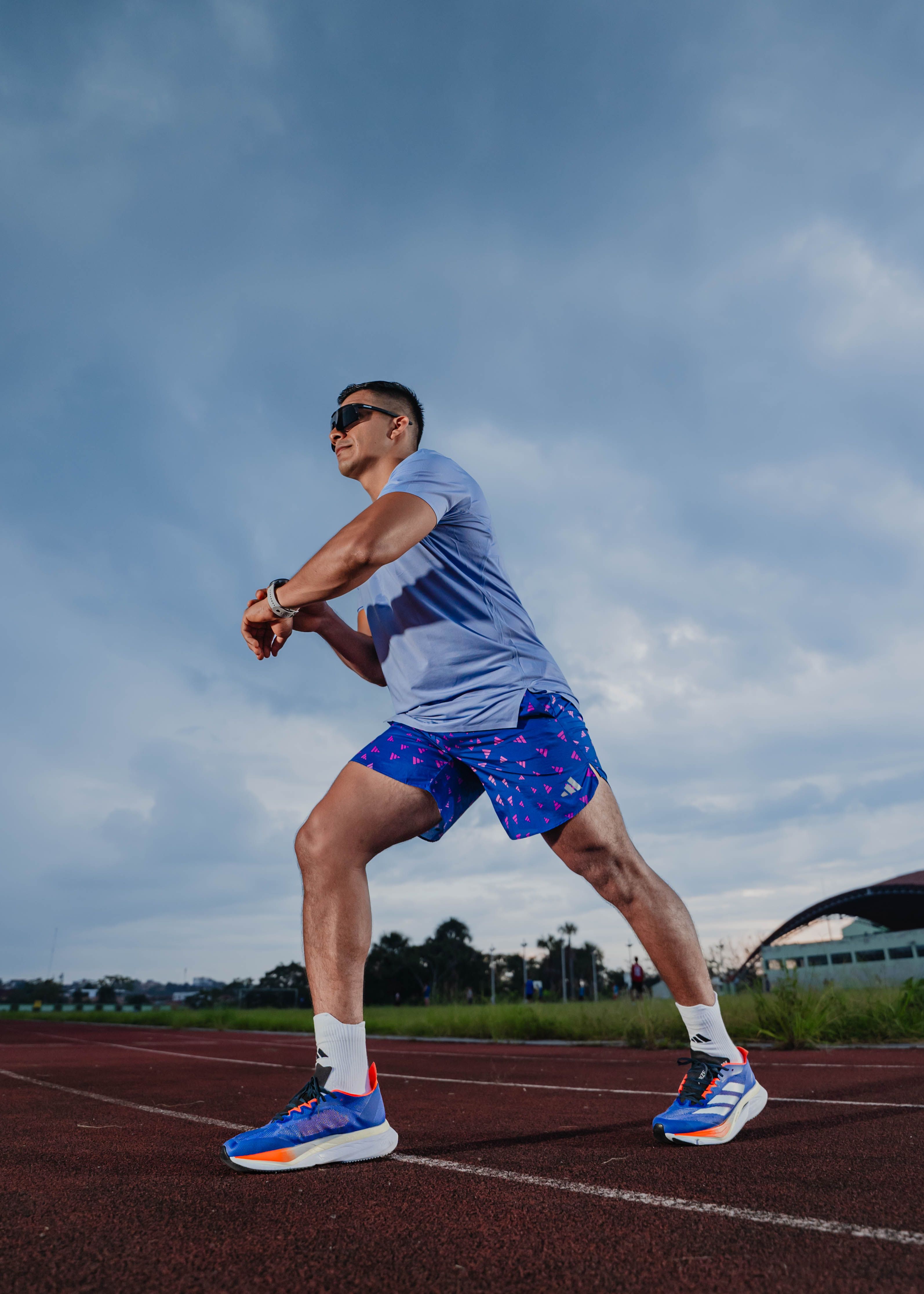 Athlete Stretching on Outdoor Track in Peru · Free Stock Photo
