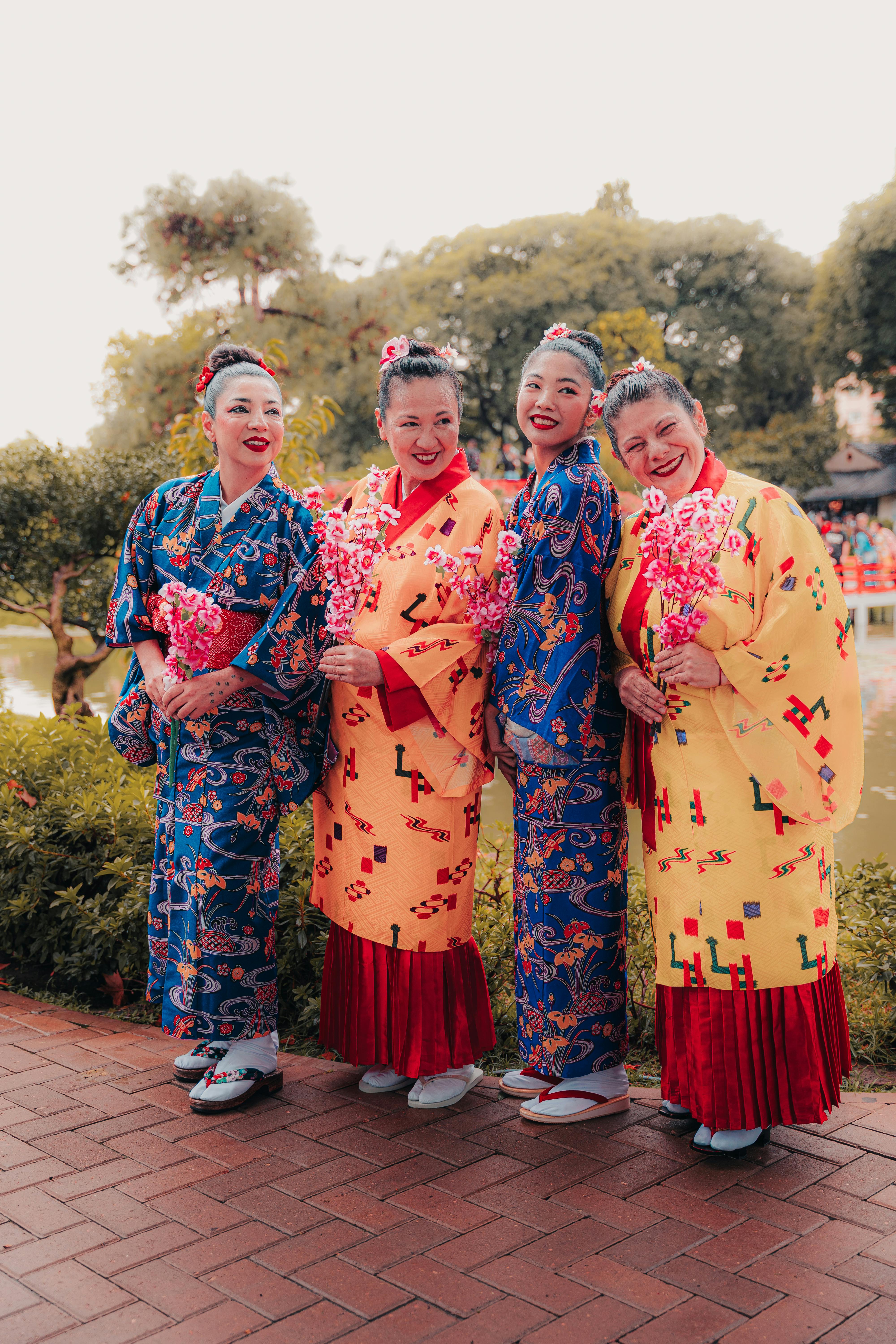 Joyful Group in Traditional Kimonos Outdoors · Free Stock Photo