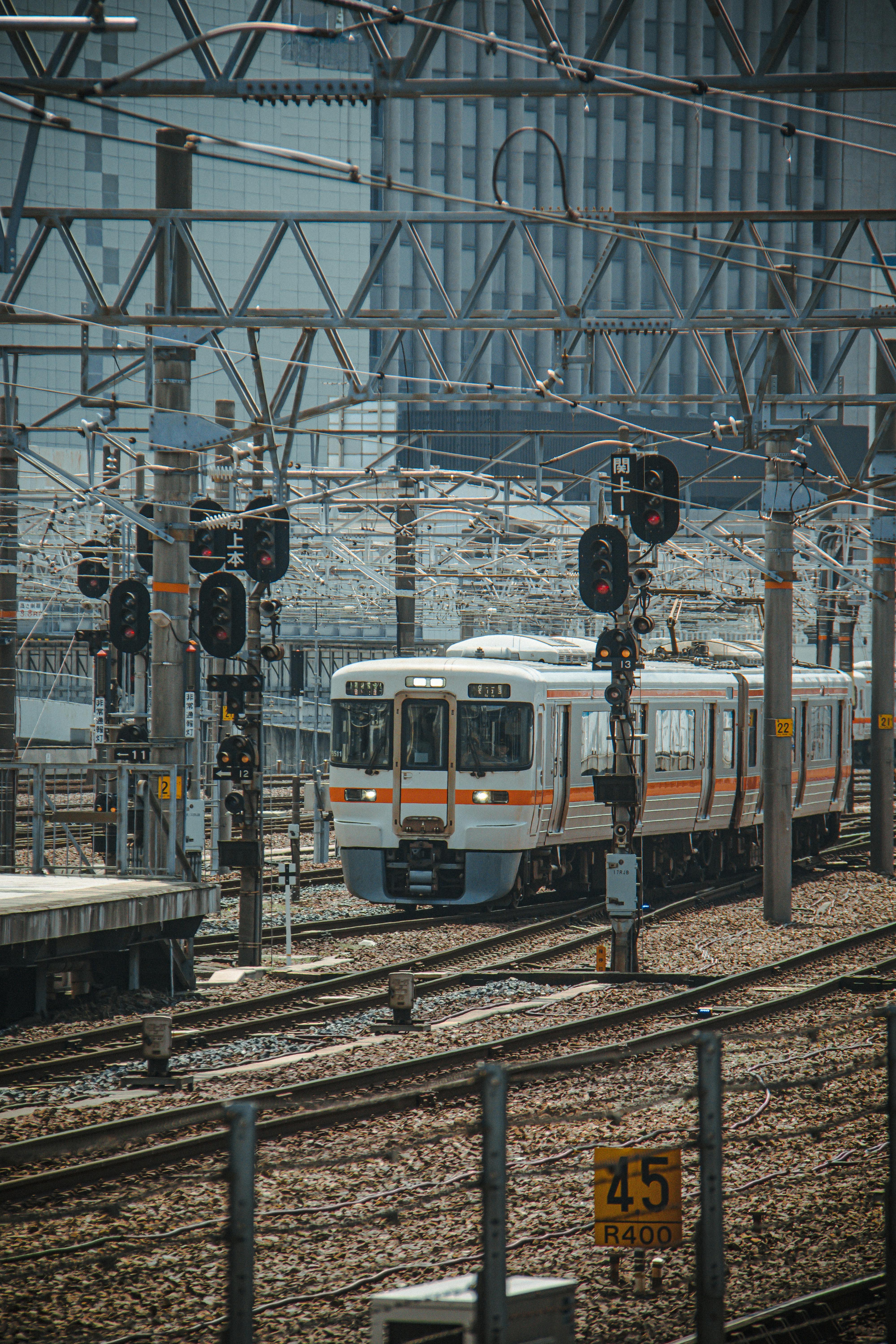 Japanese Train Station with Urban Backdrop · Free Stock Photo