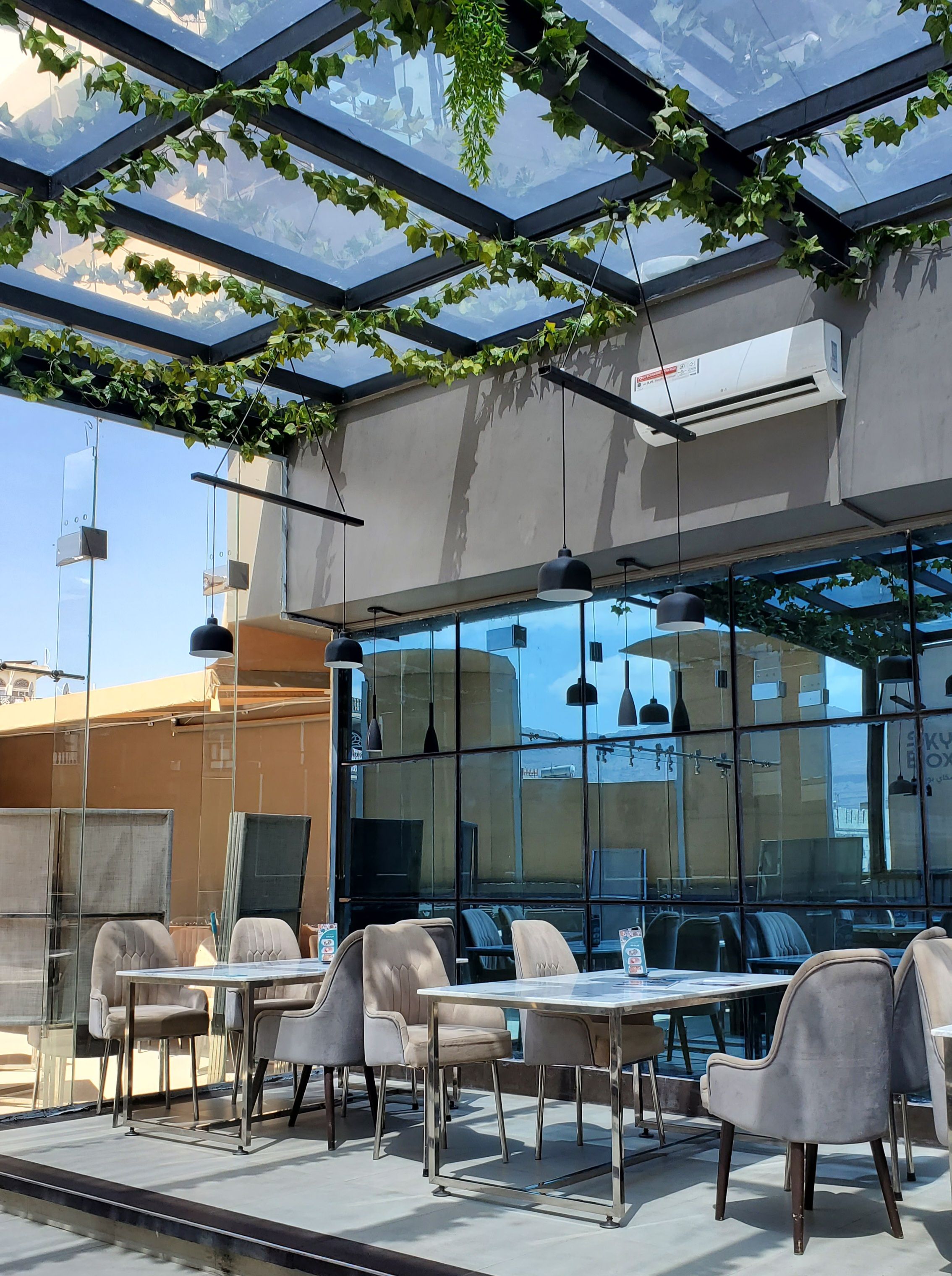 Modern Cafe Interior with Glass Ceiling · Free Stock Photo