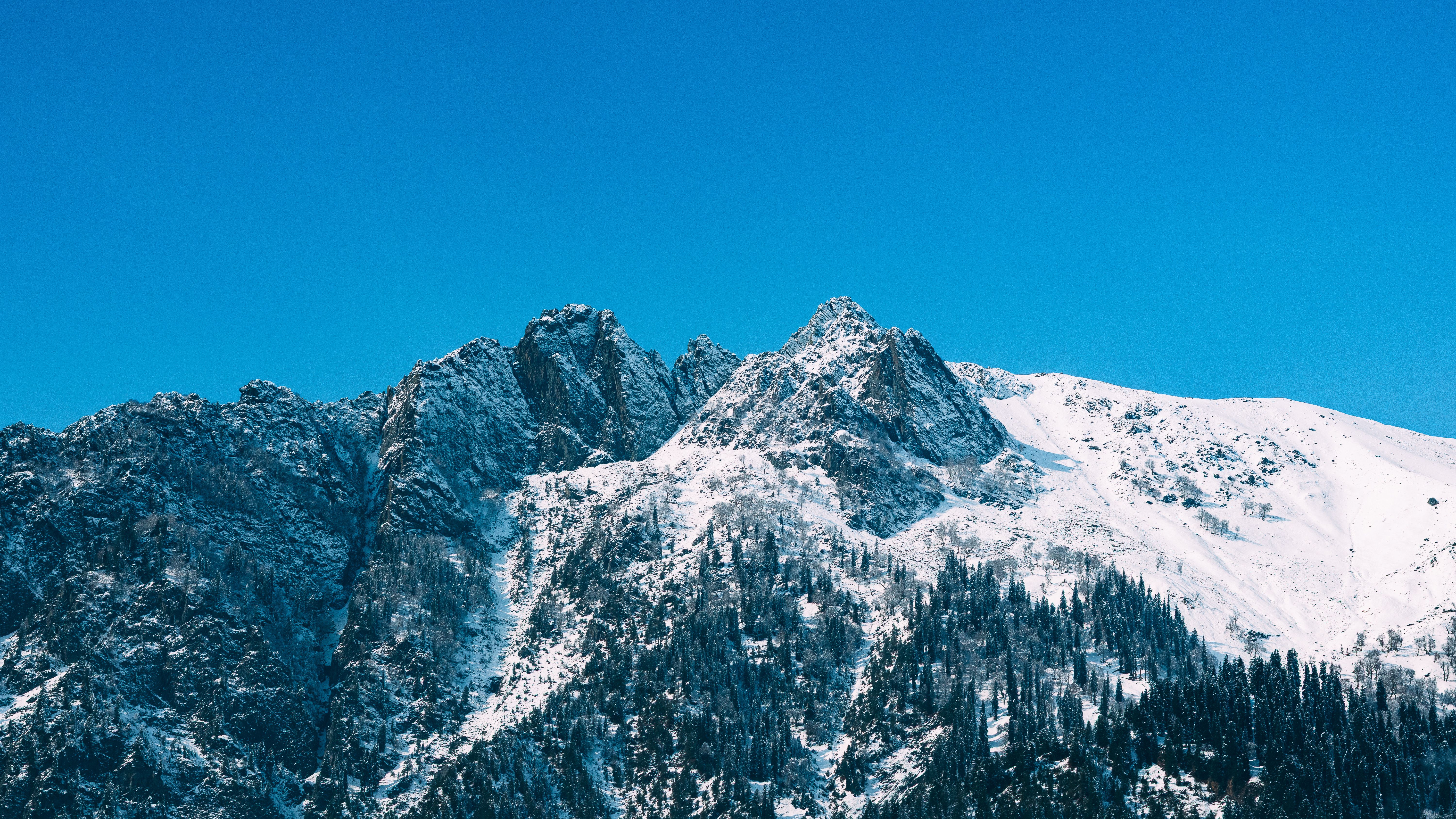Majestic Snowy Mountain Peaks Under Clear Sky · Free Stock Photo