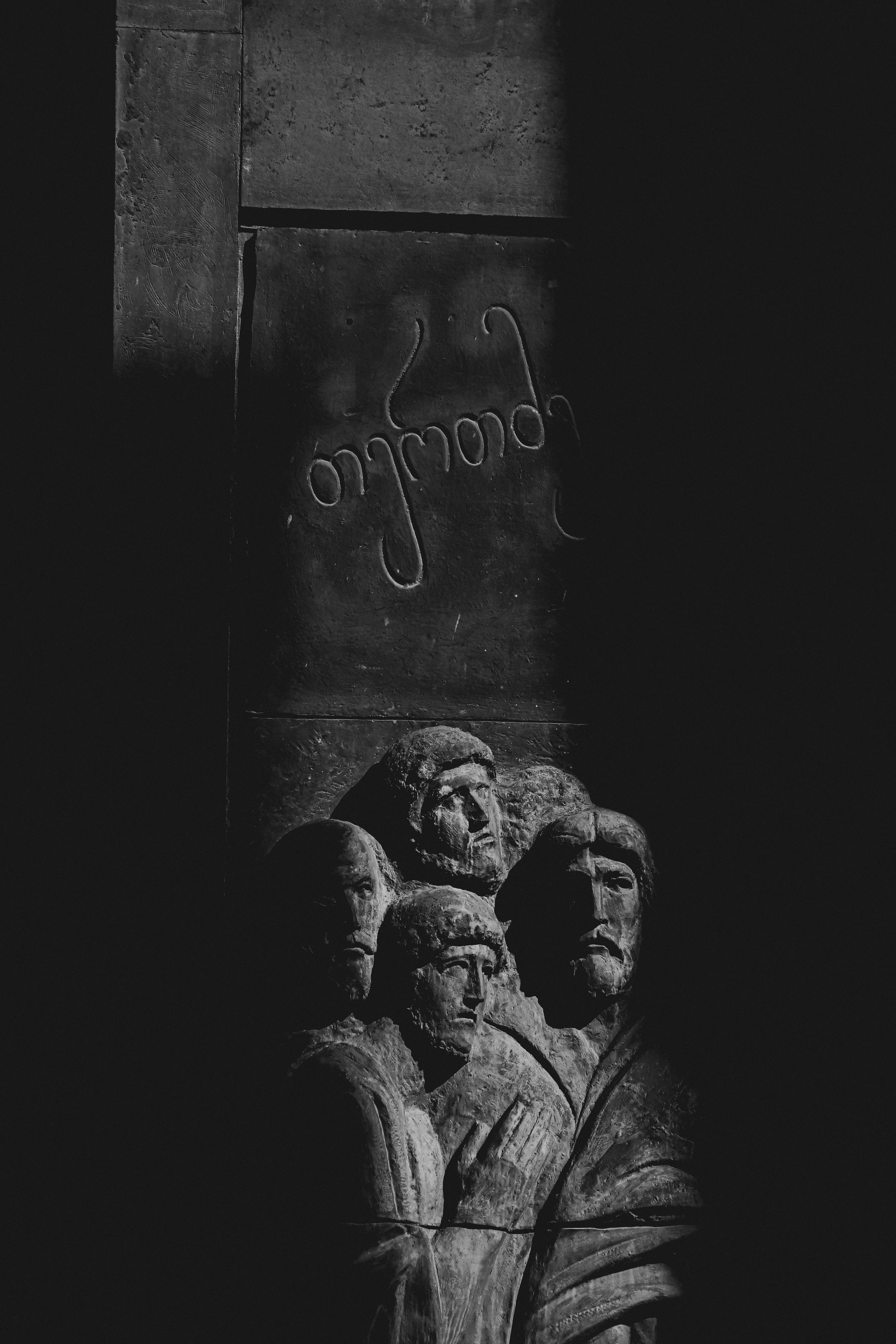 Historic Relief Sculpture in Dramatic Light · Free Stock Photo