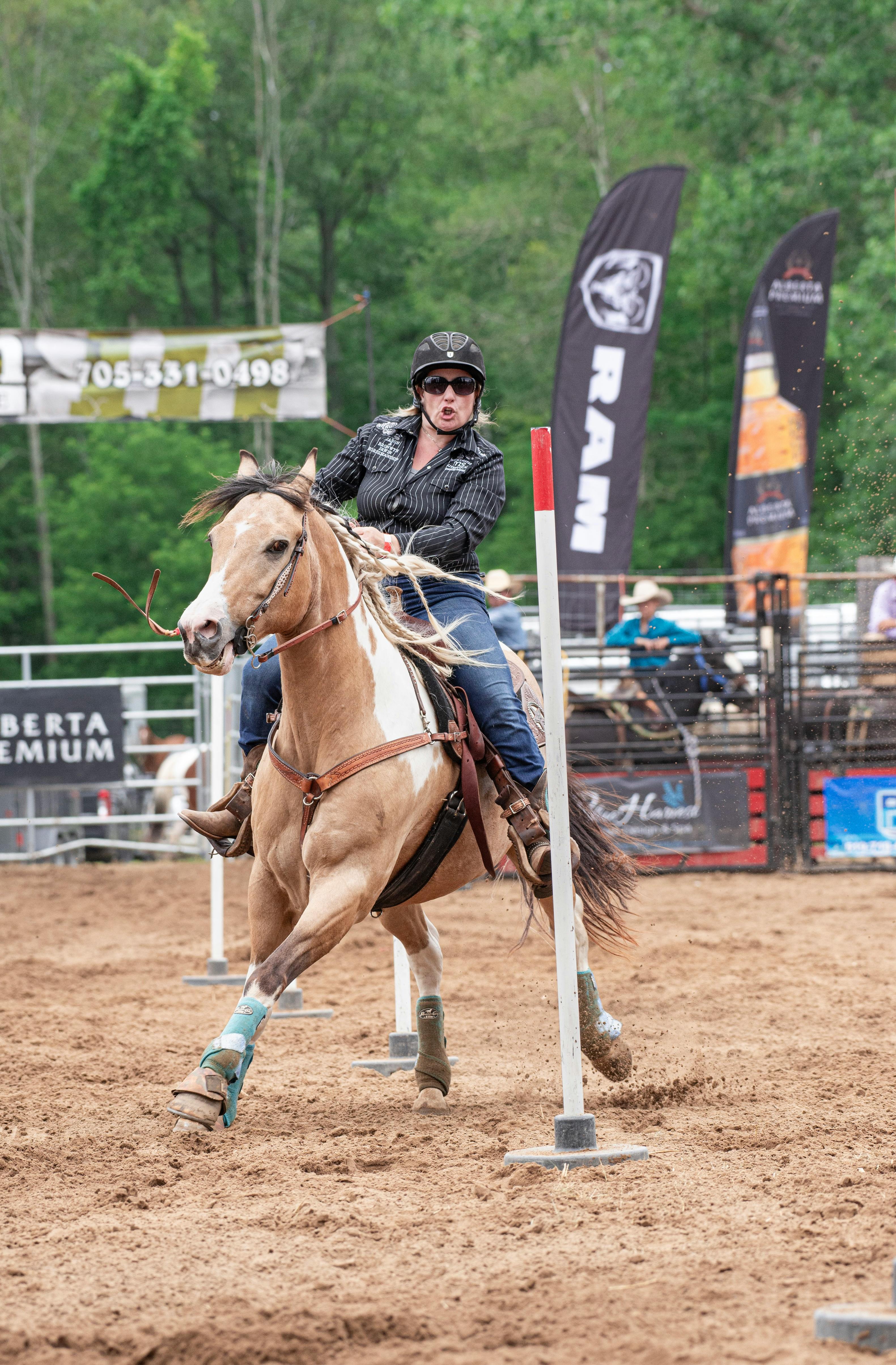 Dynamic Rodeo Pole Bending Action Shot · Free Stock Photo