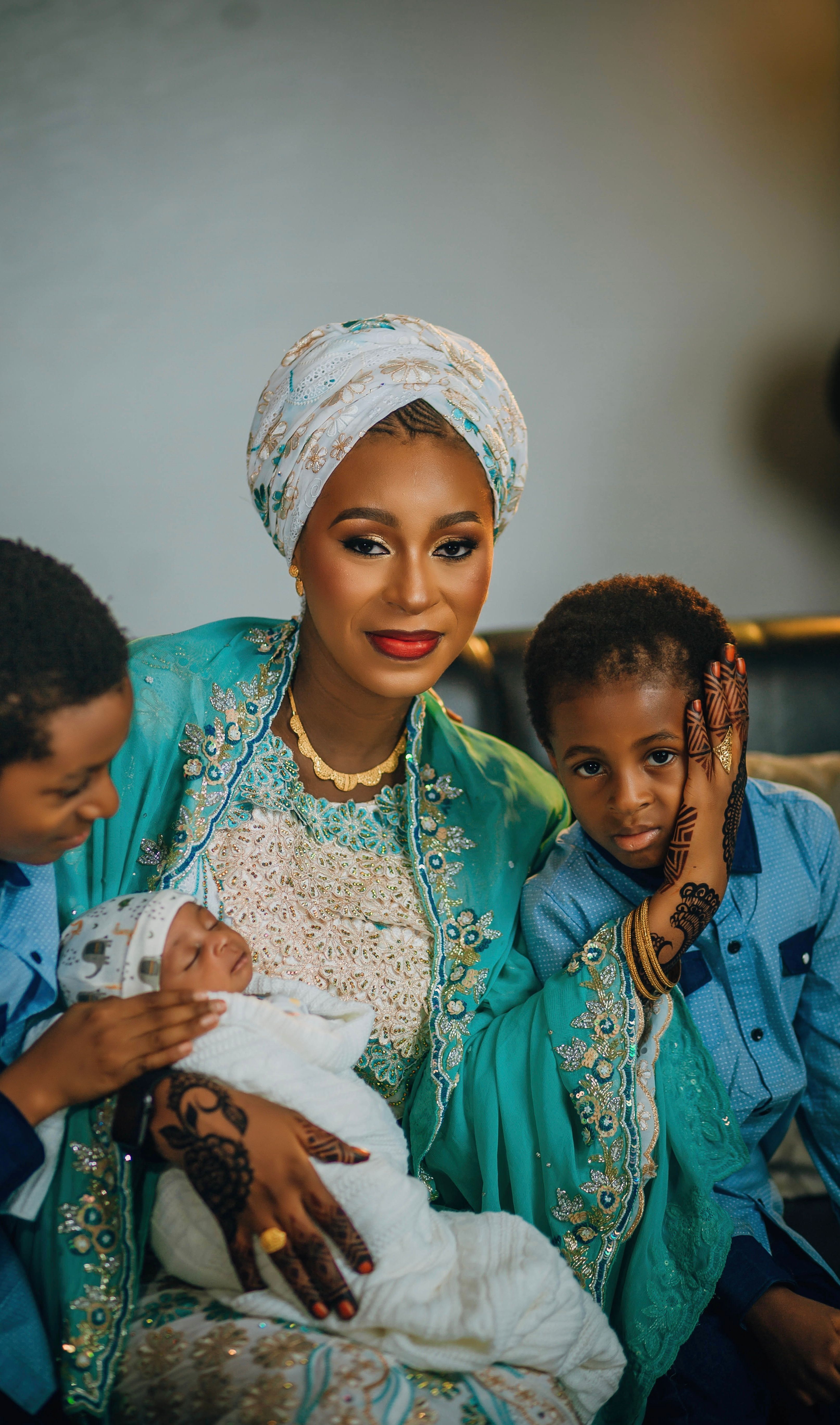 Elegant Family Portrait with Traditional Dress and Henna · Free Stock Photo