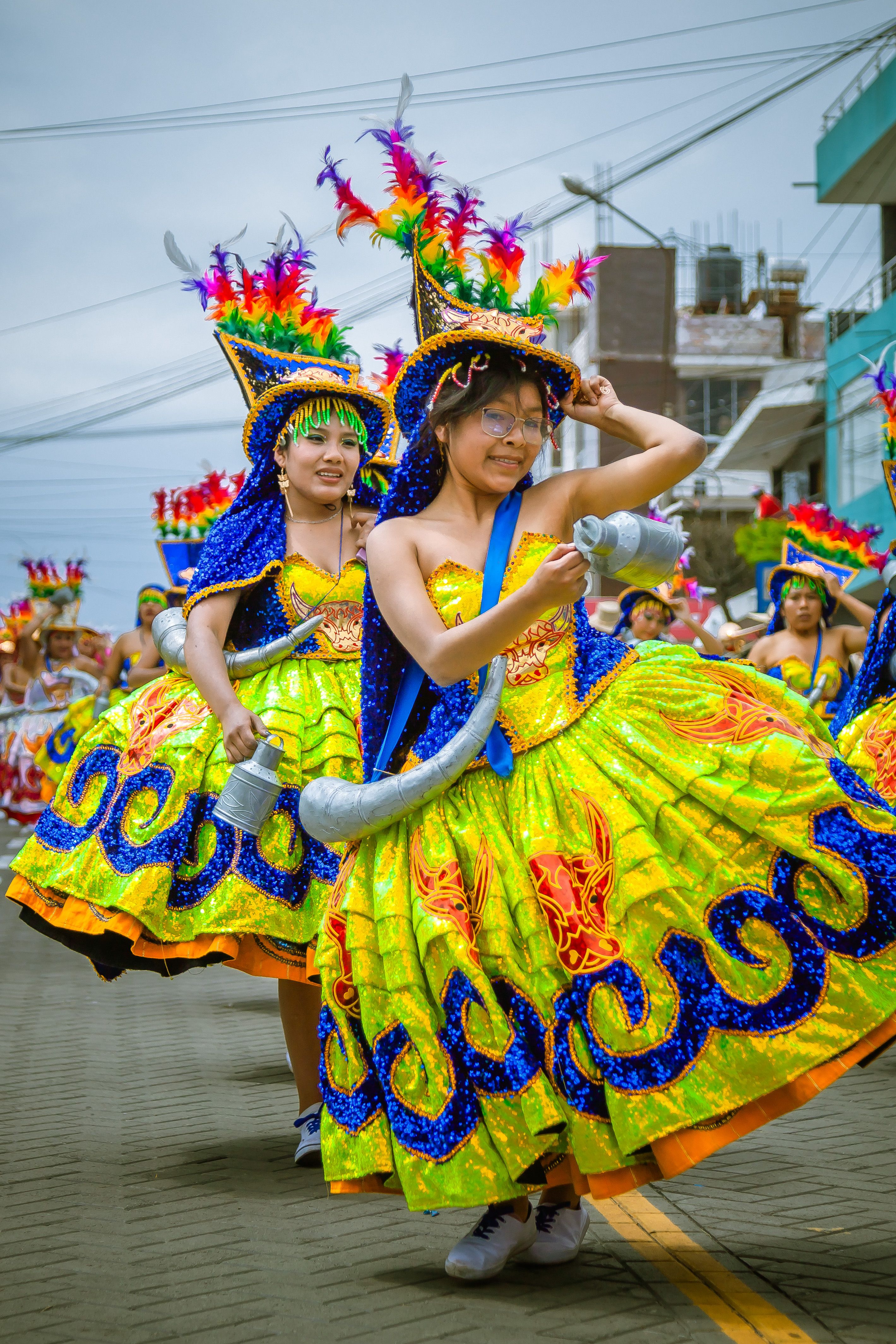Vibrant Cultural Dance Parade with Traditional Costumes · Free Stock Photo