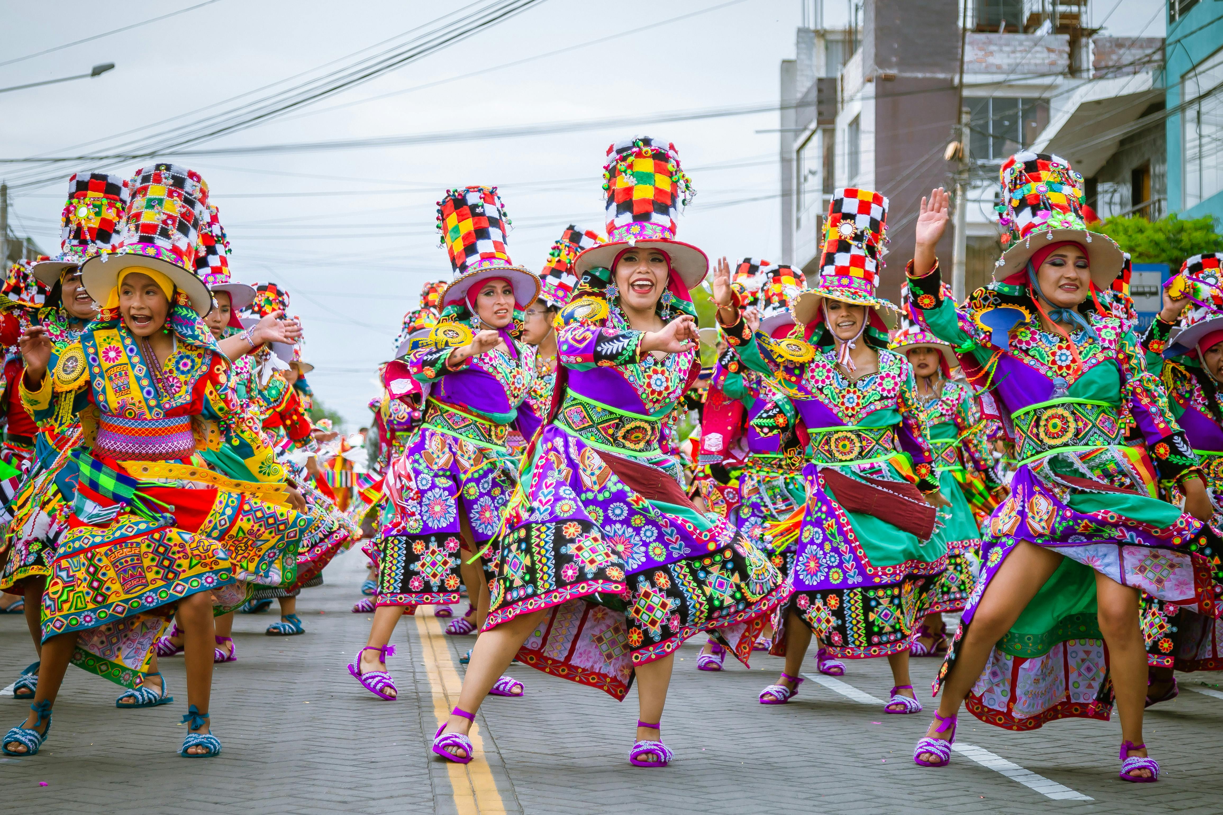 Colorful Traditional Parade with Vibrant Costumes · Free Stock Photo