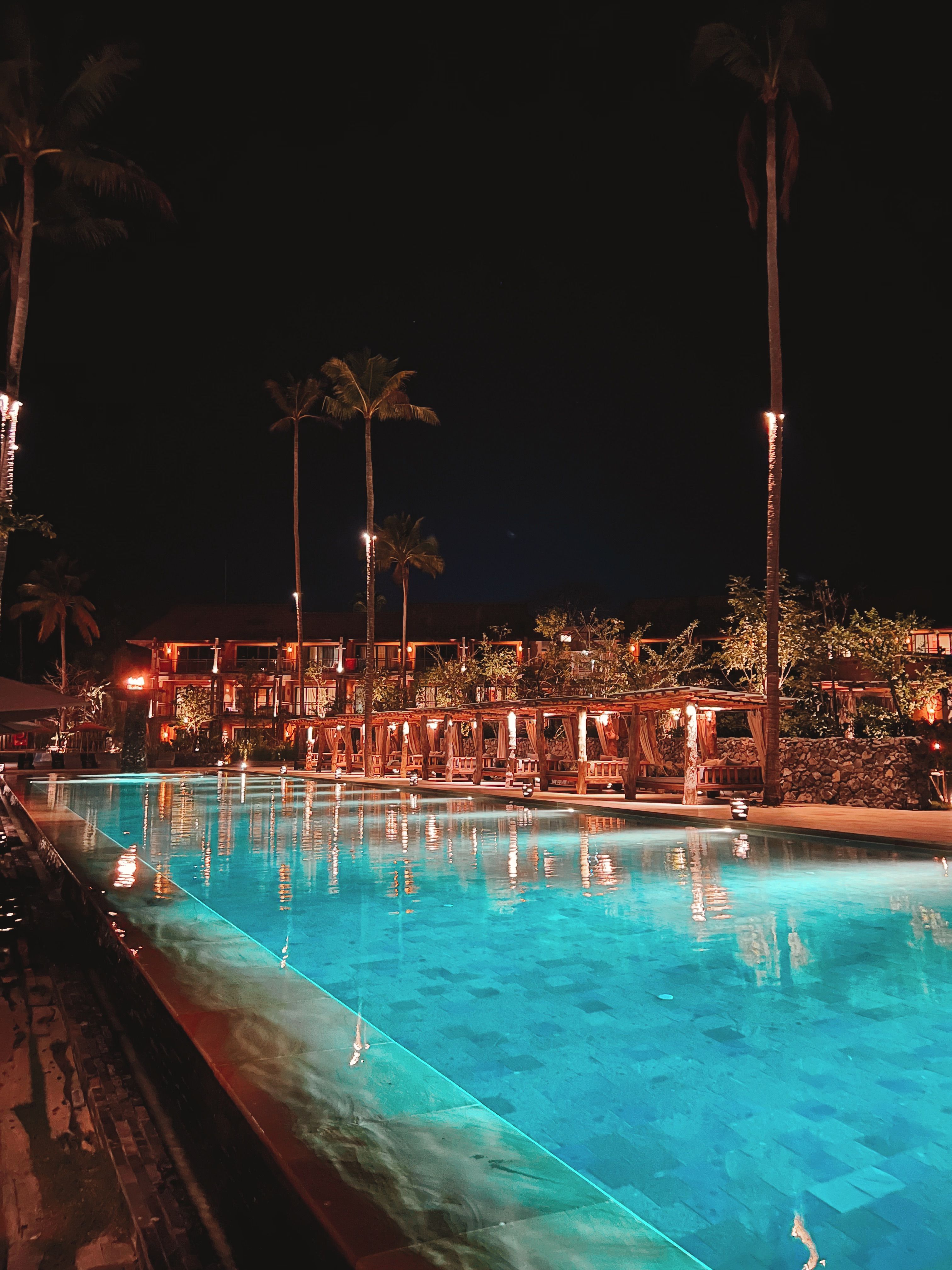 Luxurious Nighttime Resort Pool Scene · Free Stock Photo